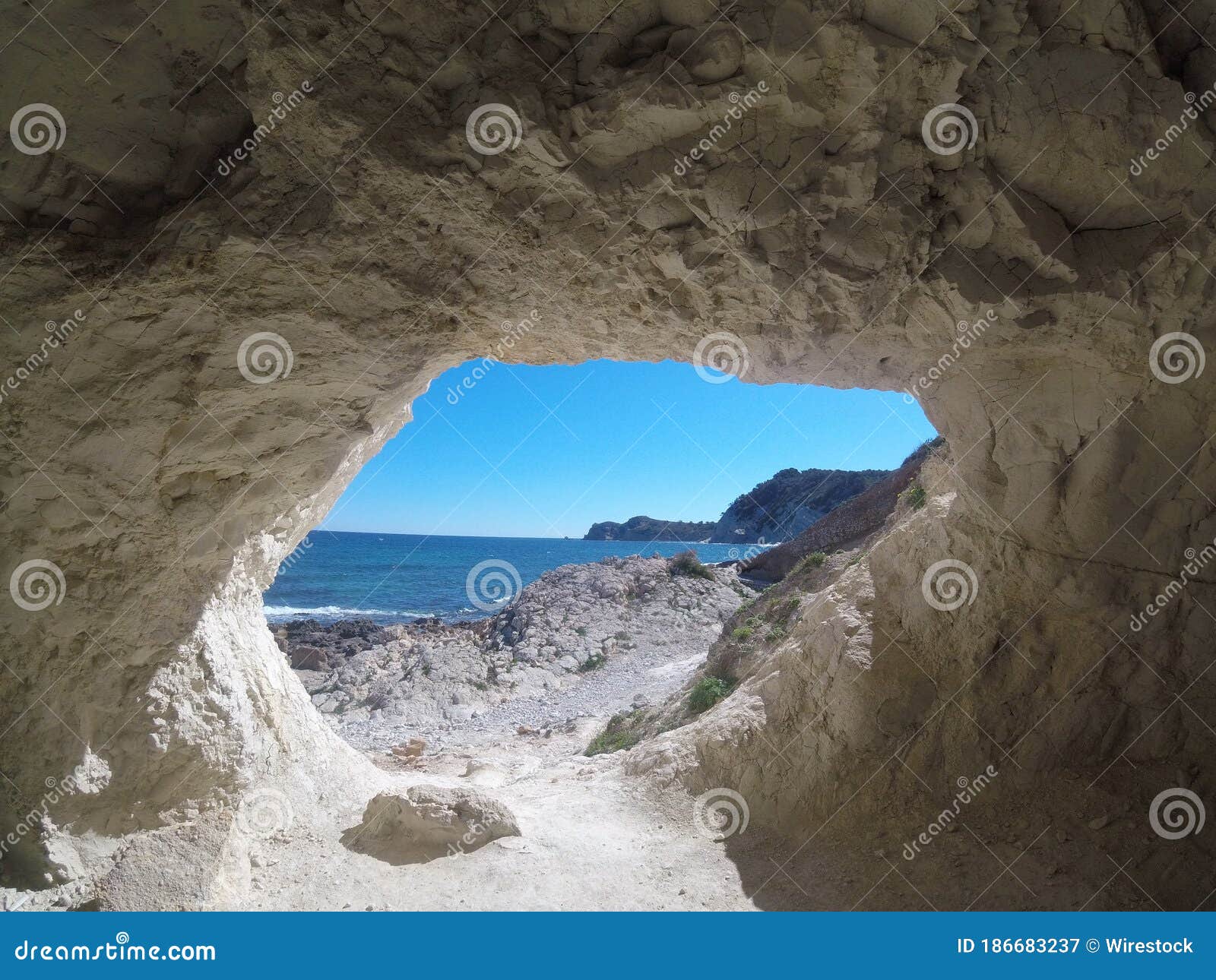 Beautiful Ocean and the Beach Captured from Inside of a Natural Cave ...
