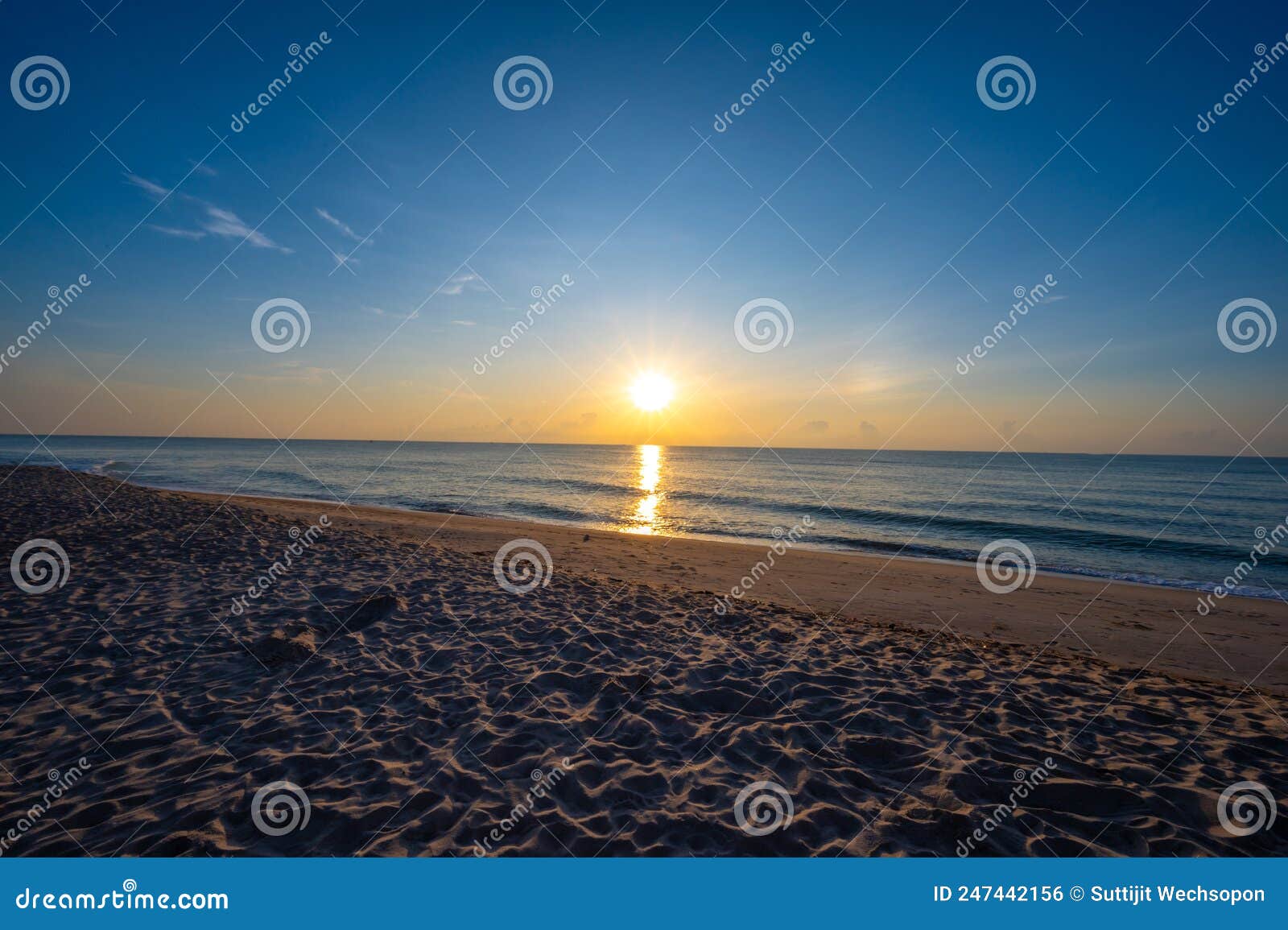Beautiful Ocean Beach Sunrise with Deep Blue Sky and Sun Rays Stock ...
