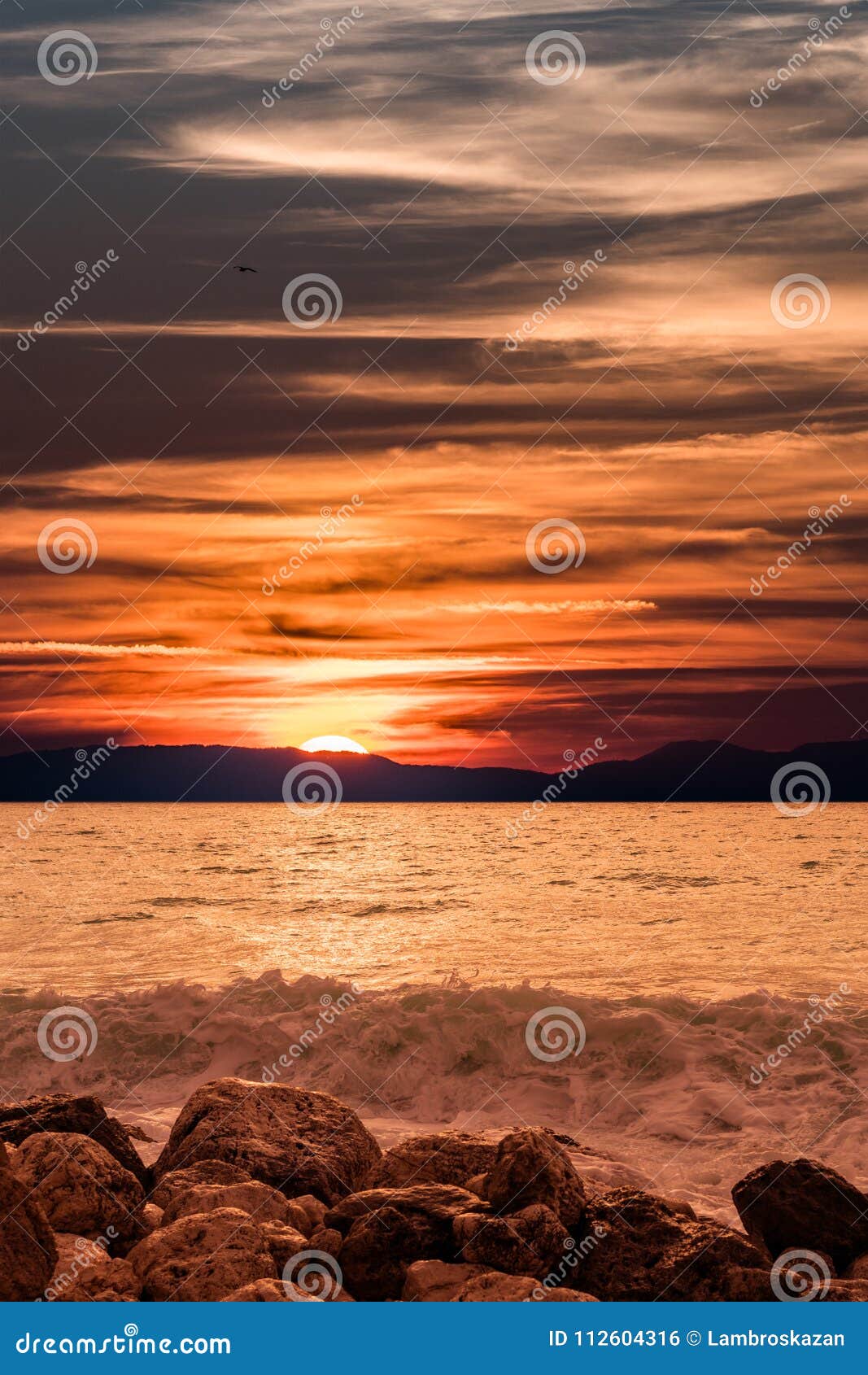 Beautiful Ocean Sunset with Sun Behind the Mountains Stock Photo ...