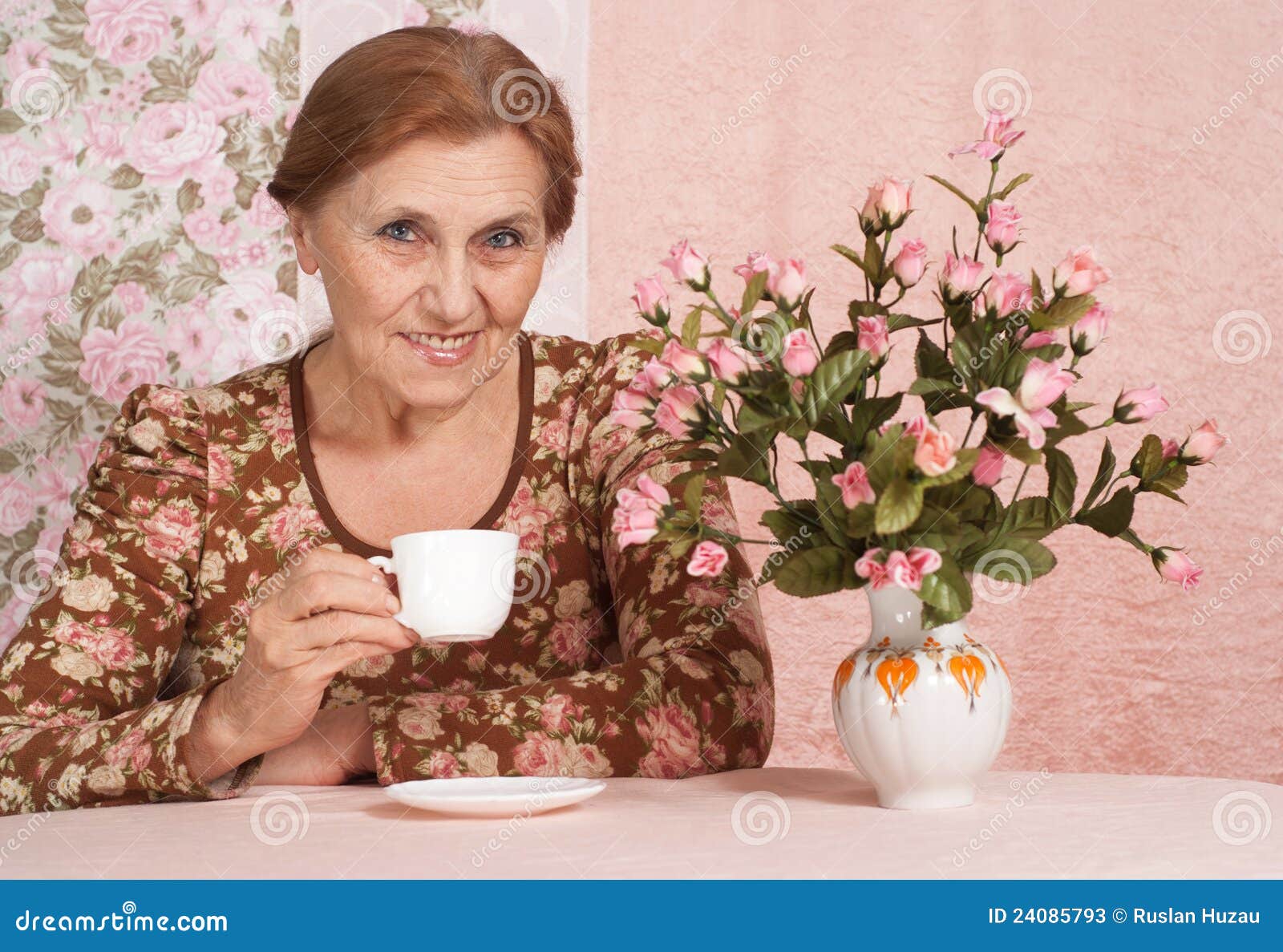 A Beautiful Older Female Sitting at a Table Stock Image - Image of ...