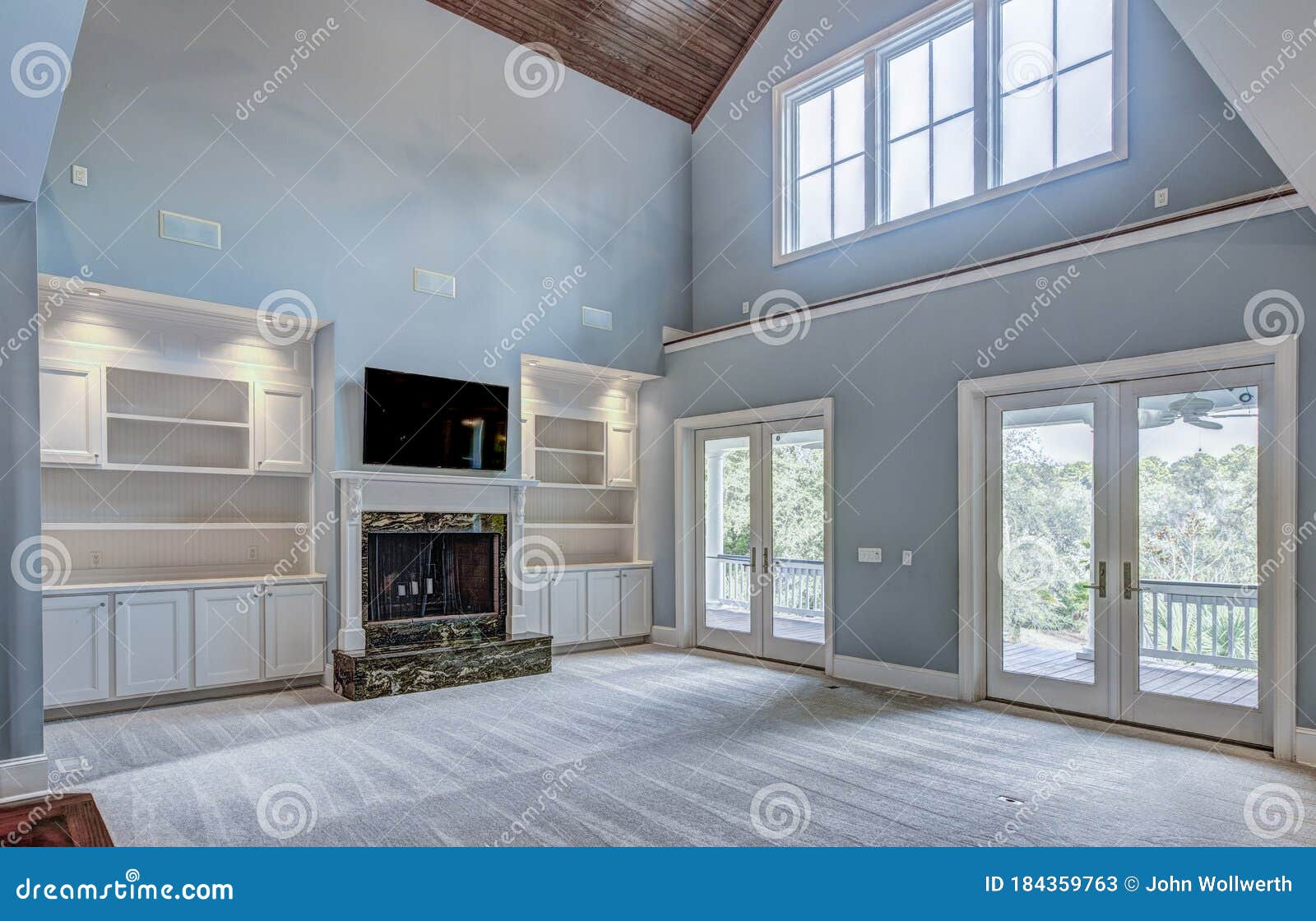 Beautiful Open Living Room with High Ceilings, Fireplace, and View ...