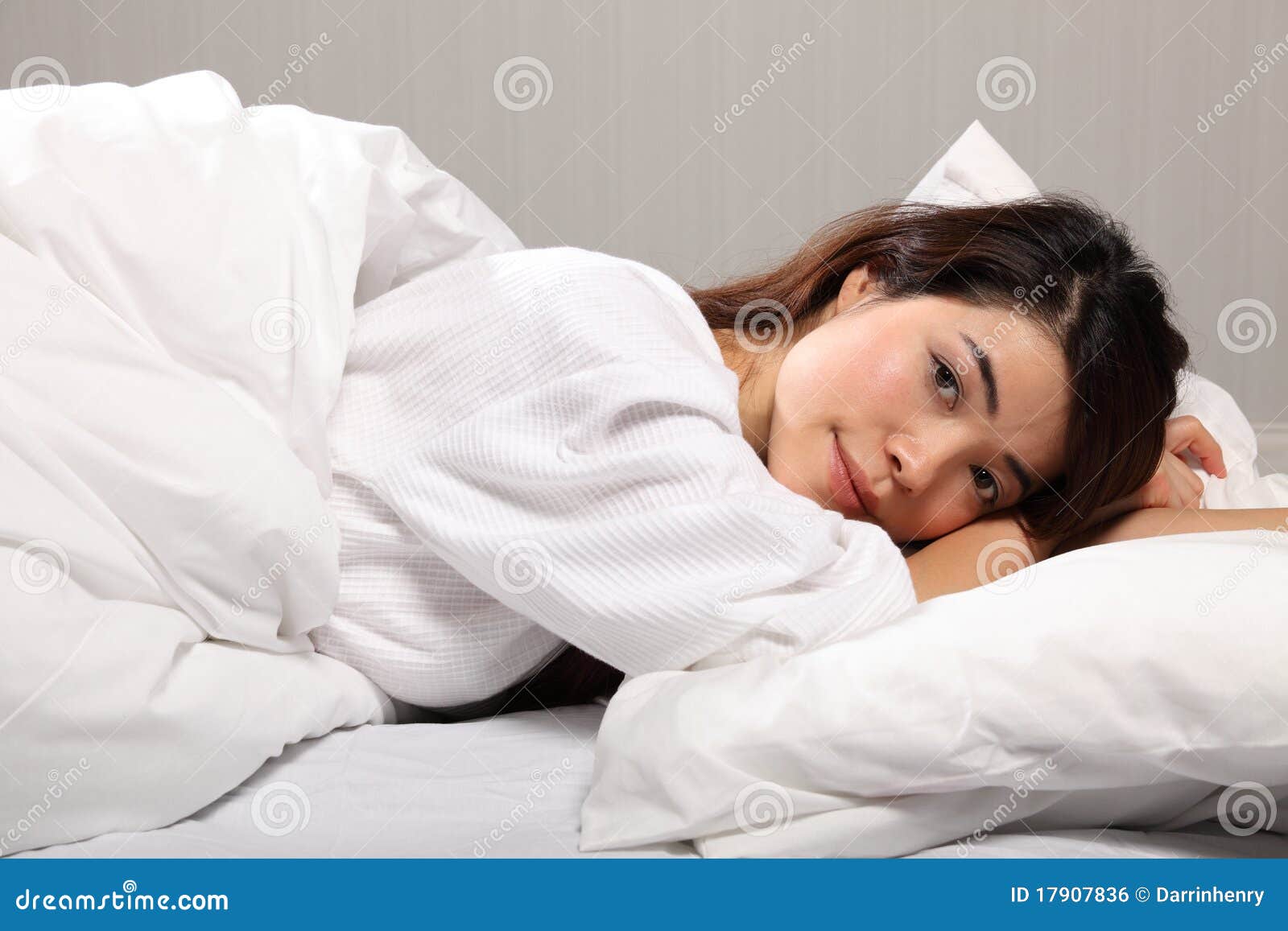 Beautiful Oriental Woman Lying in Bed Relaxing Stock Photo - Image of ...