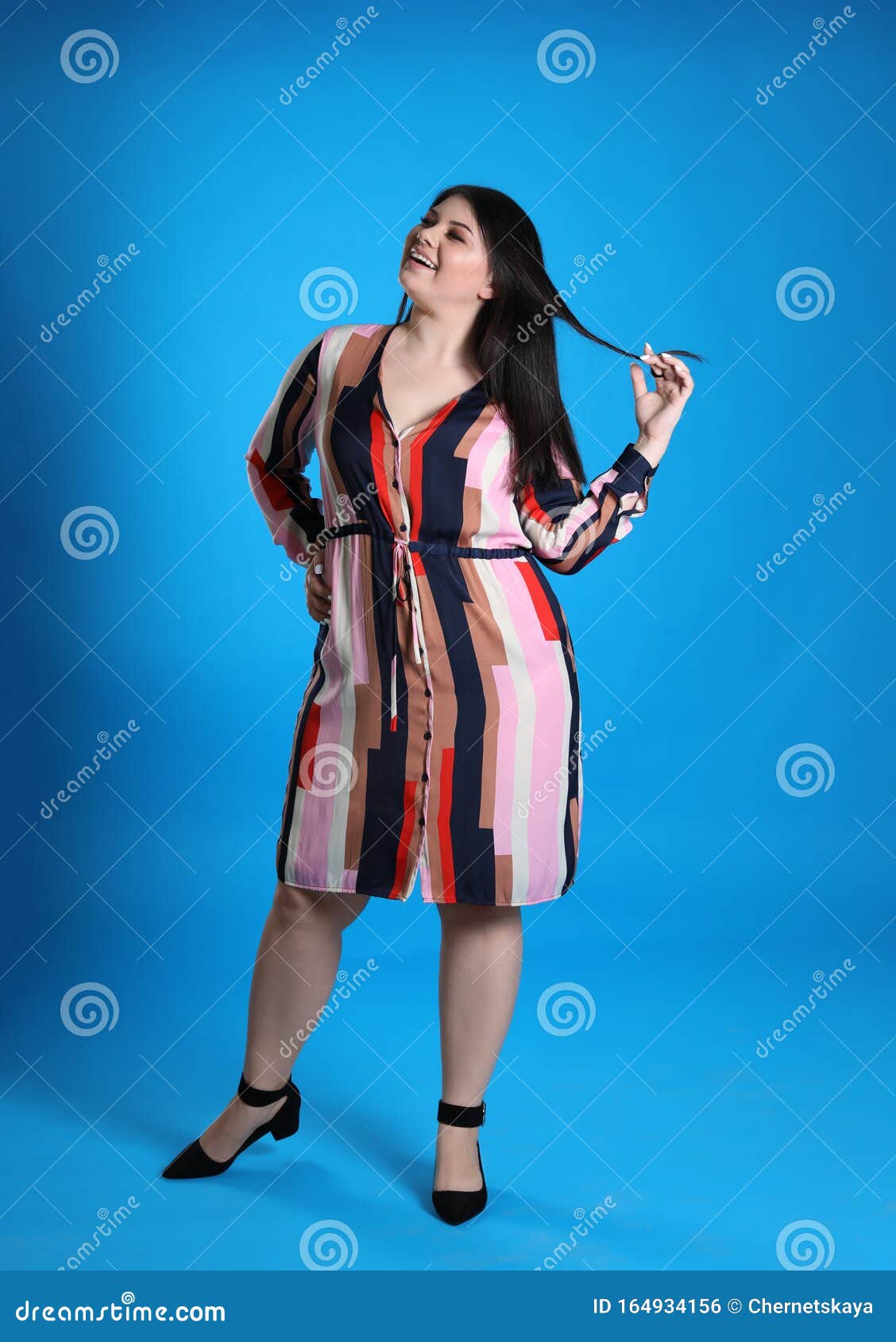 Beautiful Overweight Woman Posing on Blue Background. Plus Size Model ...