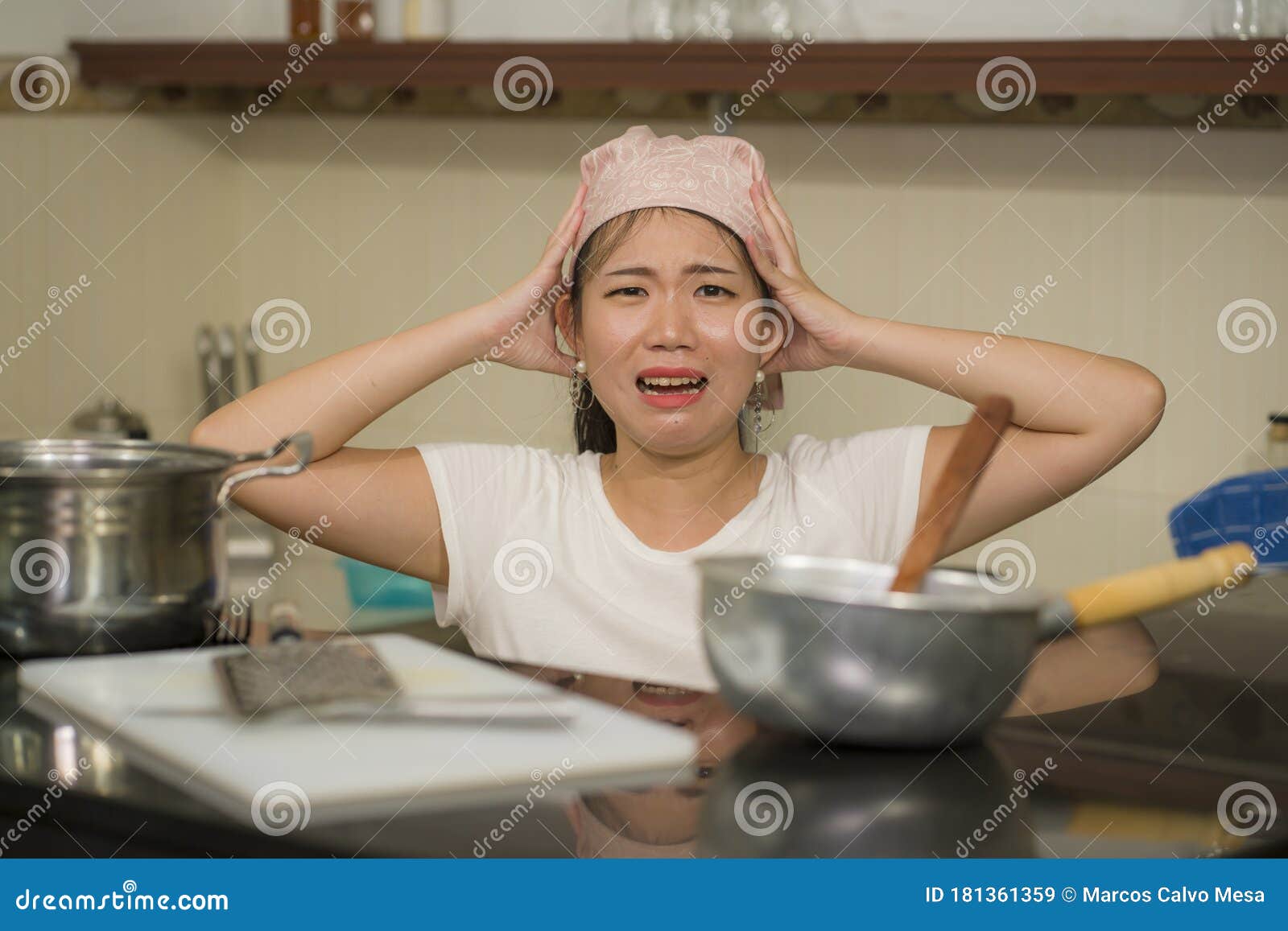 Beautiful Overwhelmed And Stressed Korean Girl Working In Kitchen