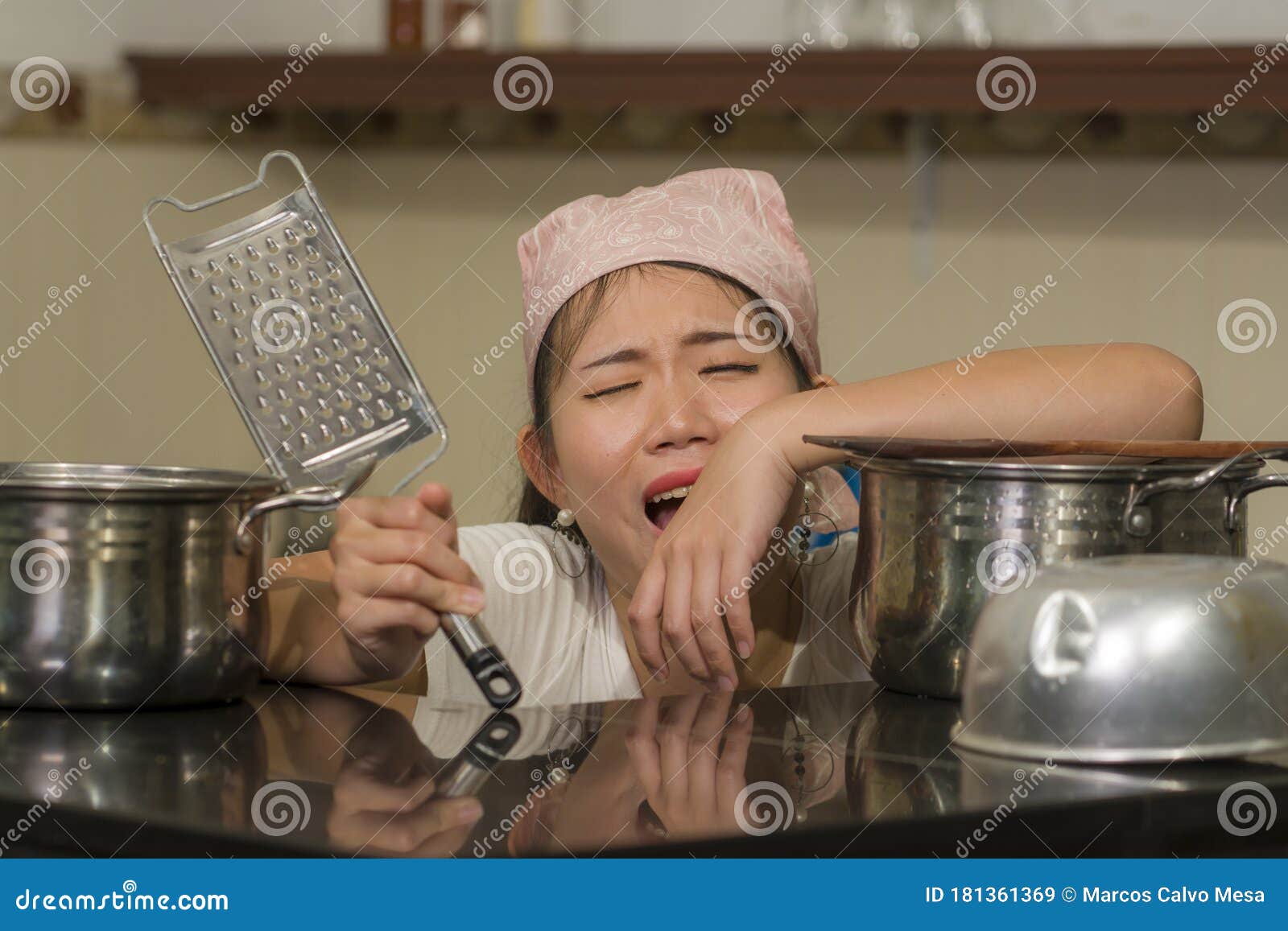 Beautiful Overwhelmed And Stressed Korean Girl Working In Kitchen