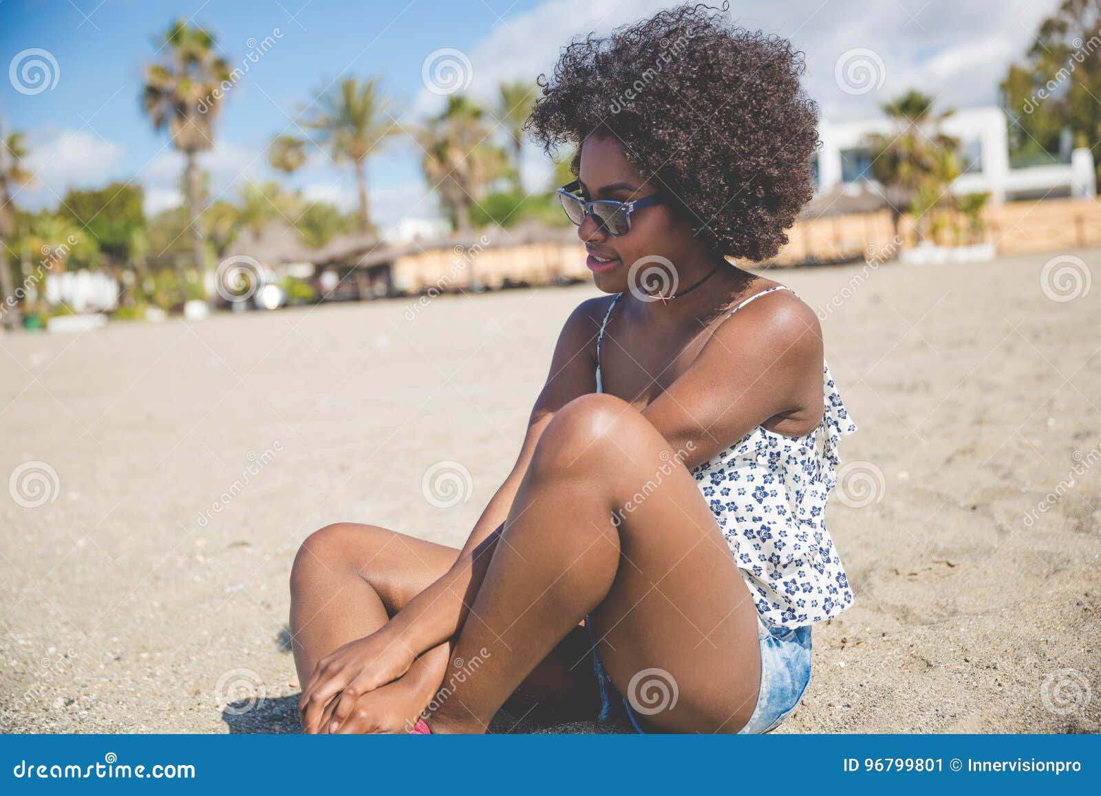 Beautiful Pensive Afro American Woman Sitting On Beach Stock Image