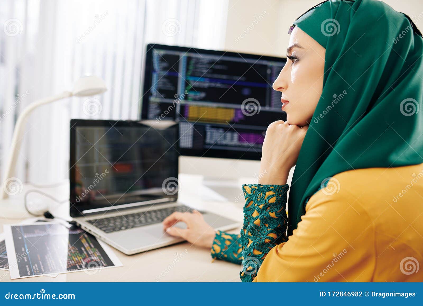 Pensive female programmer stock photo. Image of computer - 172846982