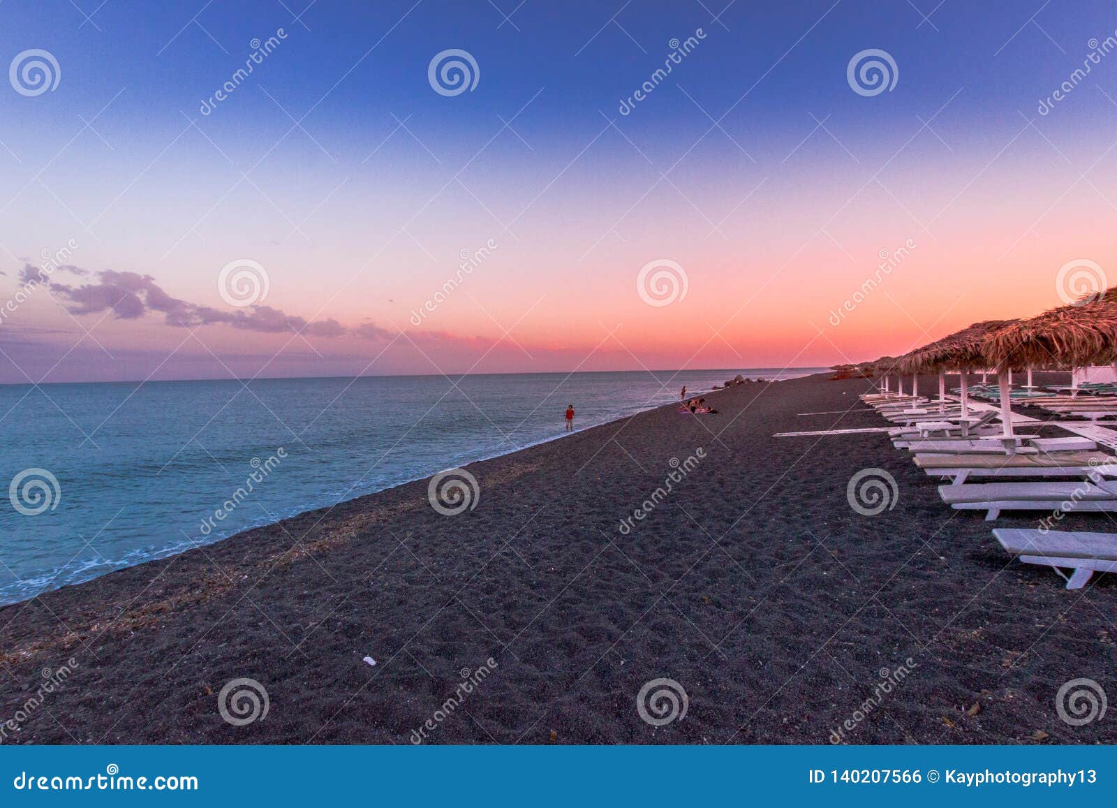 Perissa, Beach at Sunset, Santorini, Greece with Beautiful Beach Huts ...