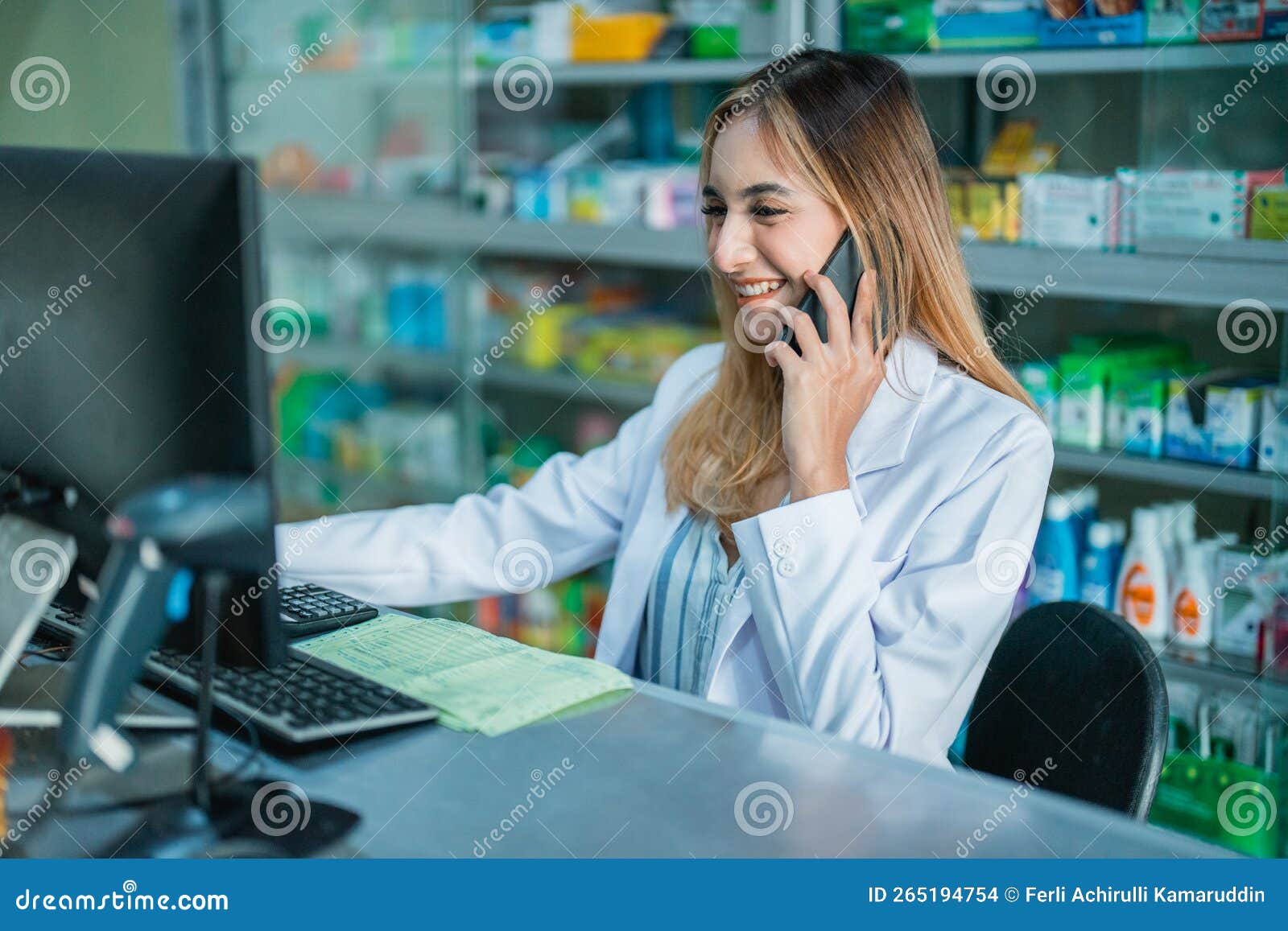 Beautiful Pharmacist Busy Working Using Computer and Taking Calls Stock ...