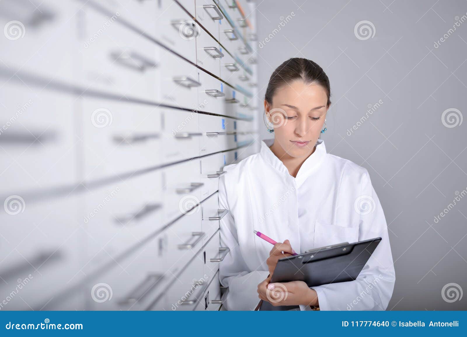 Beautiful Pharmacist Using Notepad at the Pharmacy Stock Photo - Image ...