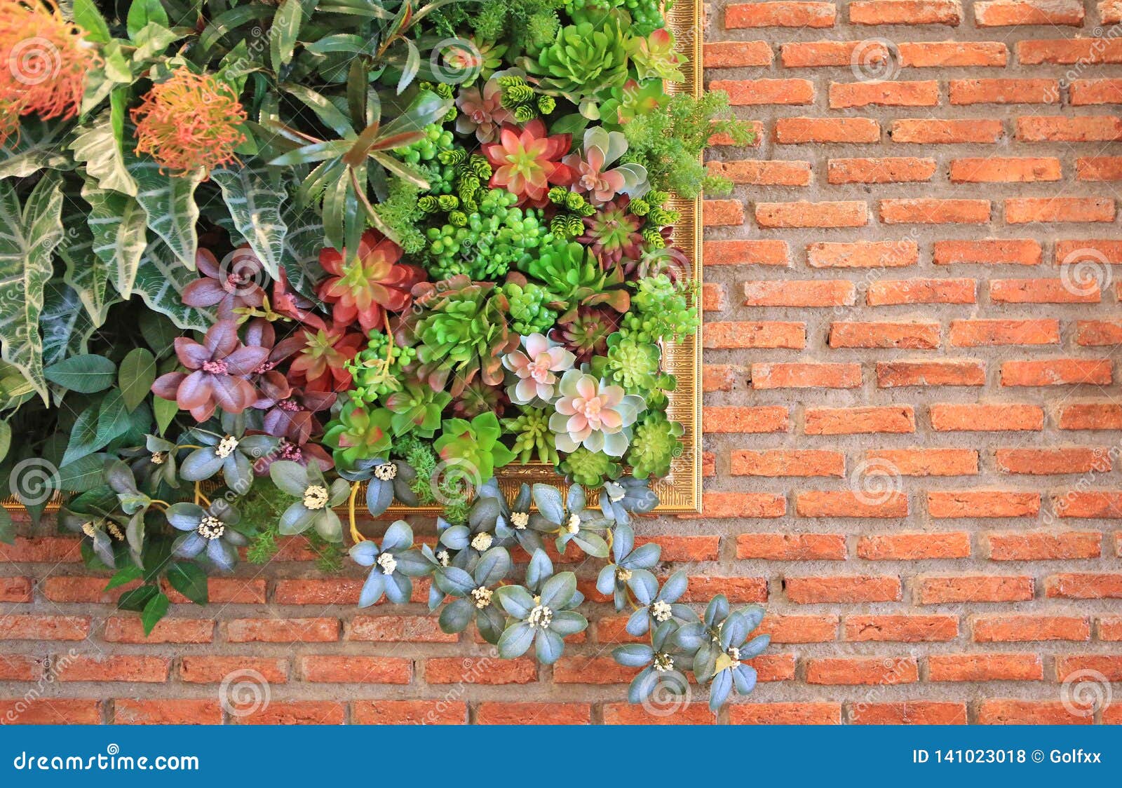 Beautiful Plastic Flower in Frame Decoration on Brick Wall Background ...