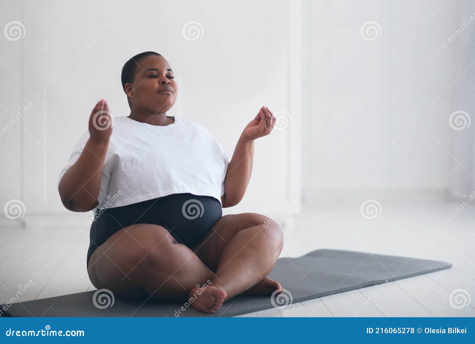 Beautiful Plus Size Woman Doing Yoga Exercise at Home Stock Photo ...