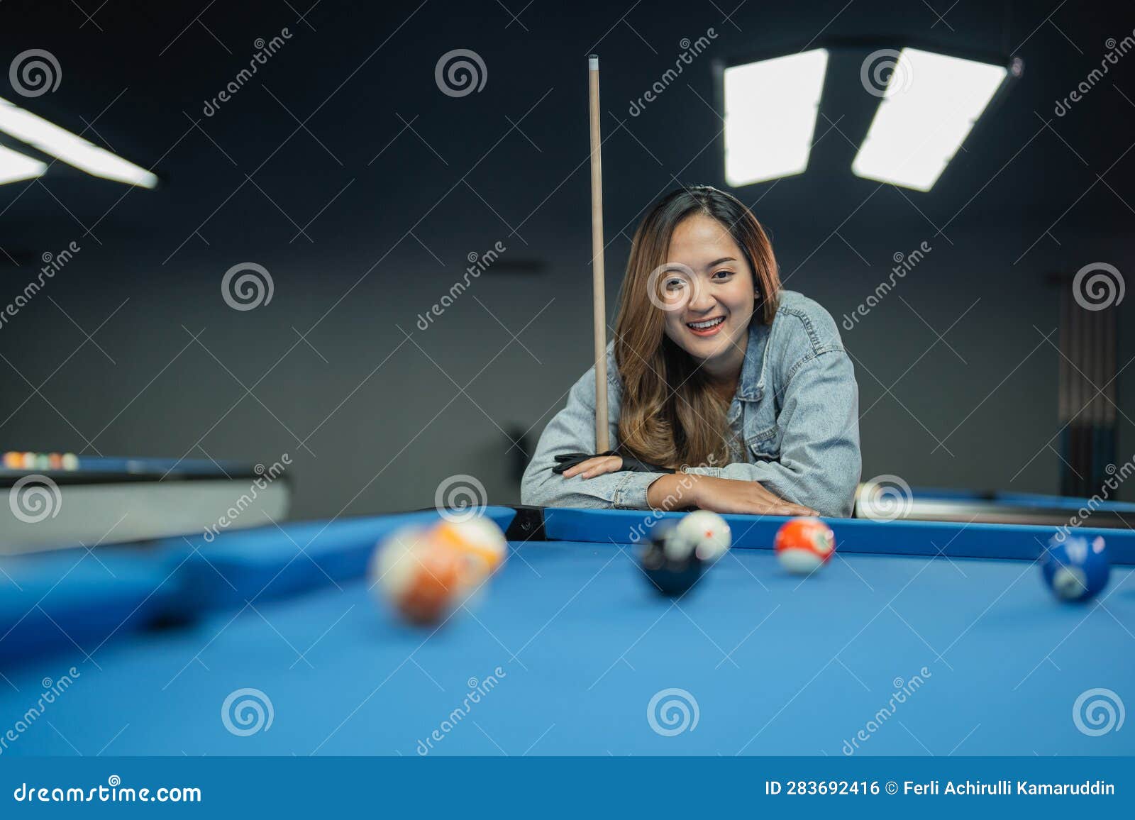 Beautiful Pool Player Smiling while Standing Crossing Hands on the Pool ...