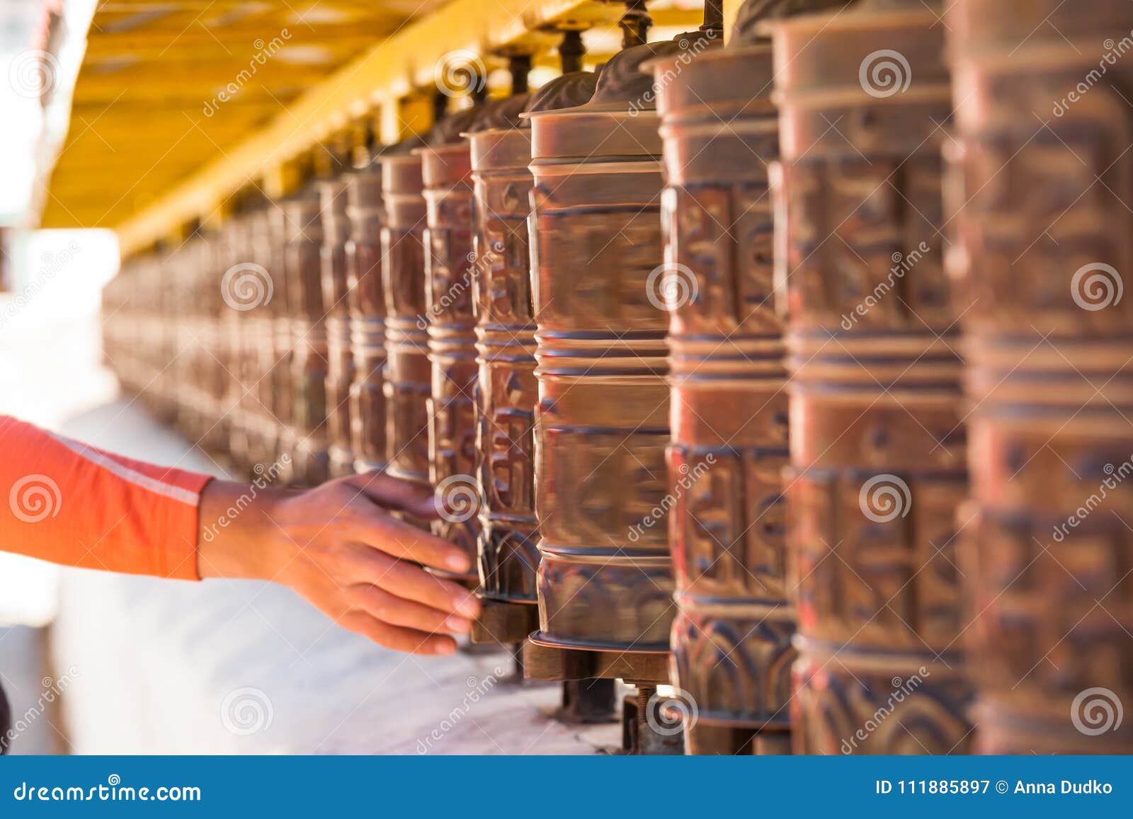 Praying Drums. Line Of Vintage Copper Praying Drums With Sanskrit ...