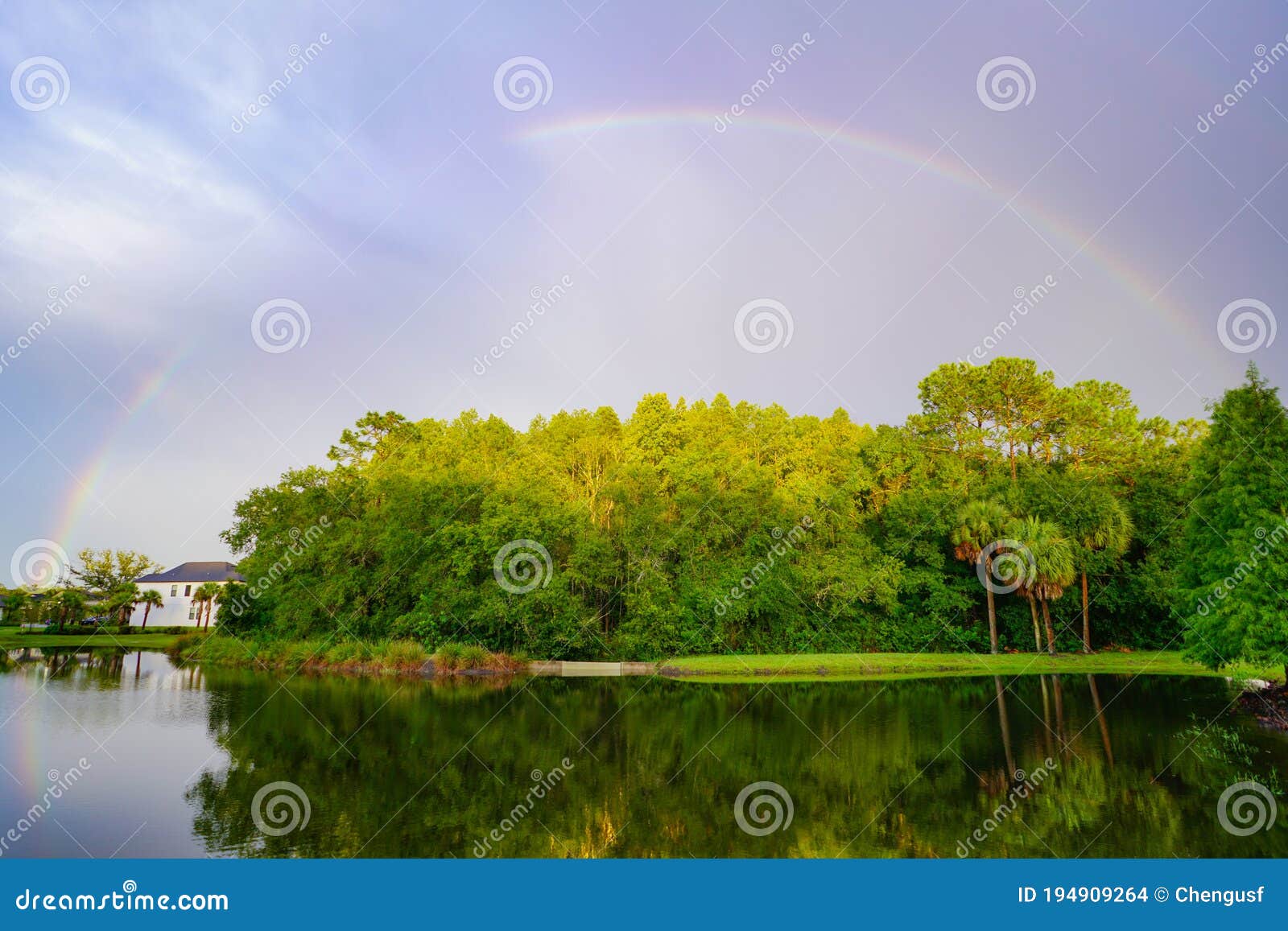 Beautiful double rainbow stock photo. Image of fence - 194909264
