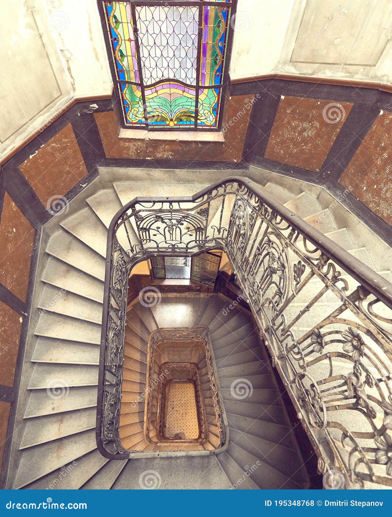 Beautiful Rectangular Spiral Staircase with Black Railings and Part of ...