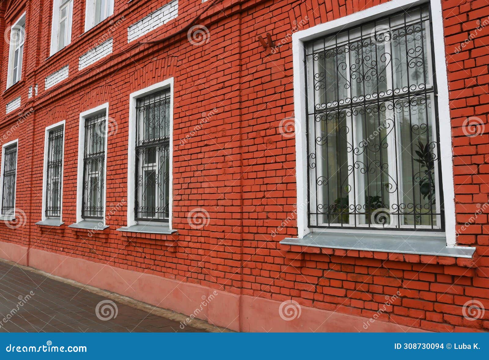 Beautiful Red Brick Facade Windows with Wrought Iron Ornate Grilles ...
