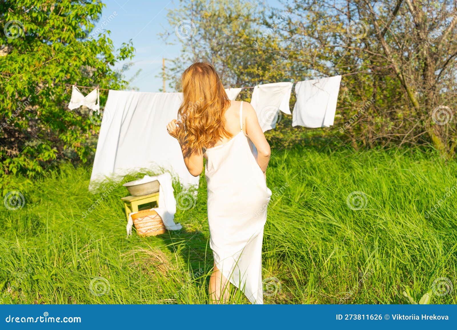 Beautiful Red Girl In Nightie Hanging Laundry Outdoors Village Woman