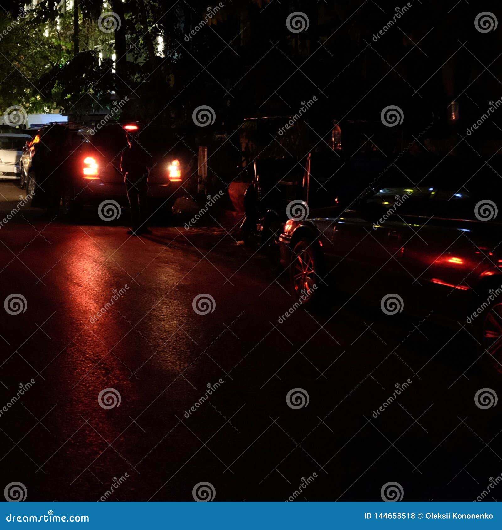Beautiful Red Light from the Car`s Rear Lights Reflects Off the Surface ...