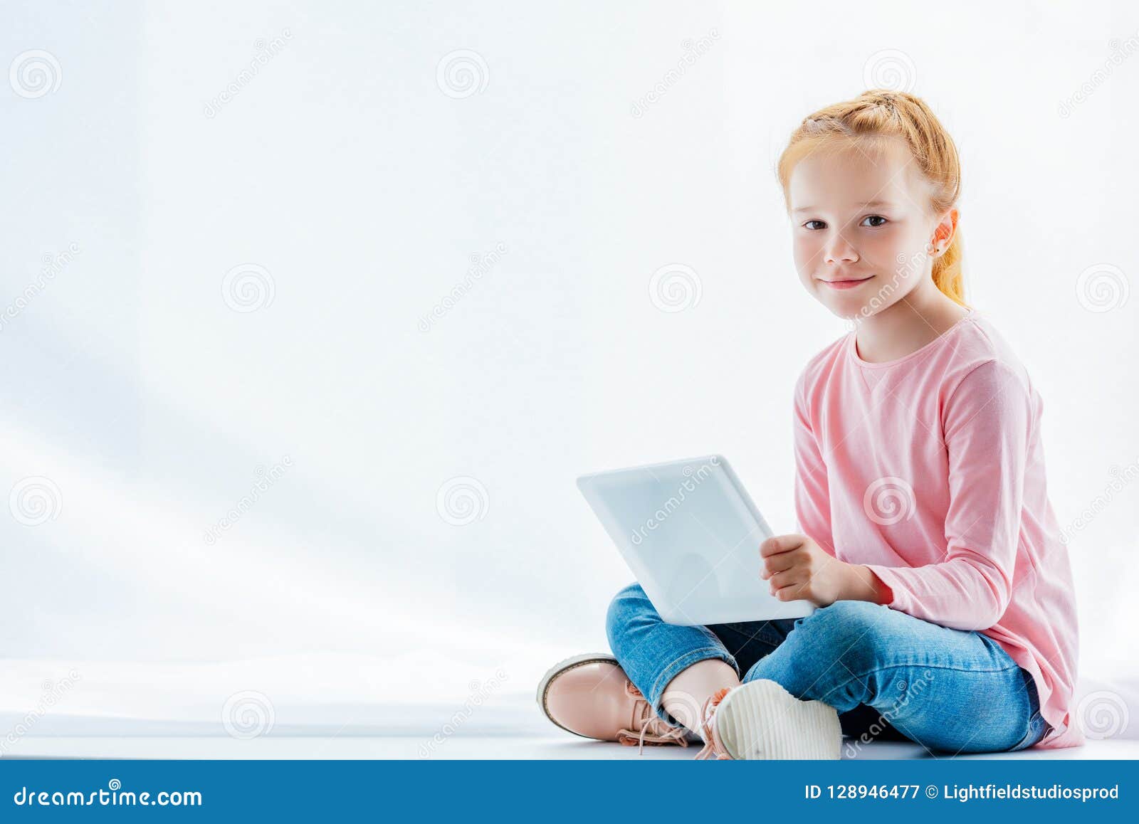 Beautiful Redhead Child Using Digital Tablet and Smiling at Camera ...