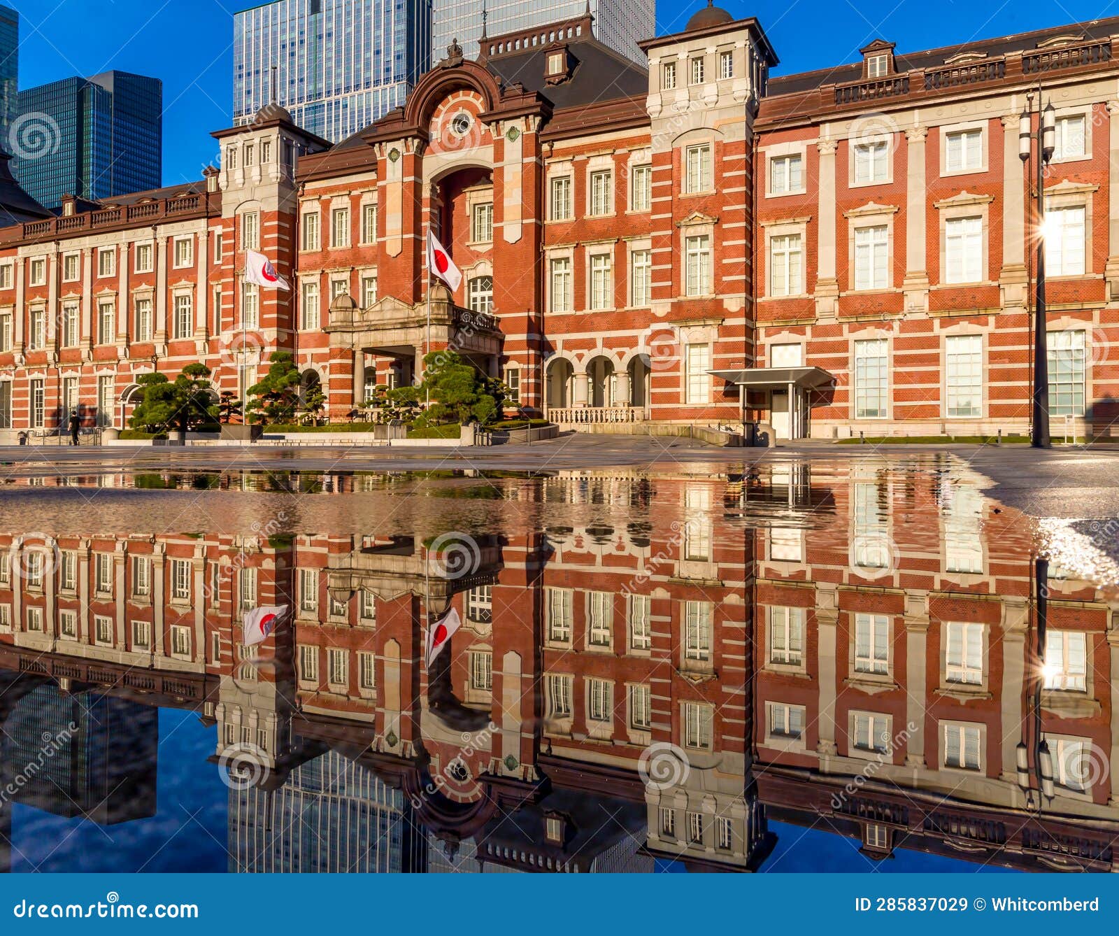 Beautiful Reflection of the Red Brick Tokyo Station in Water Sprayed To ...