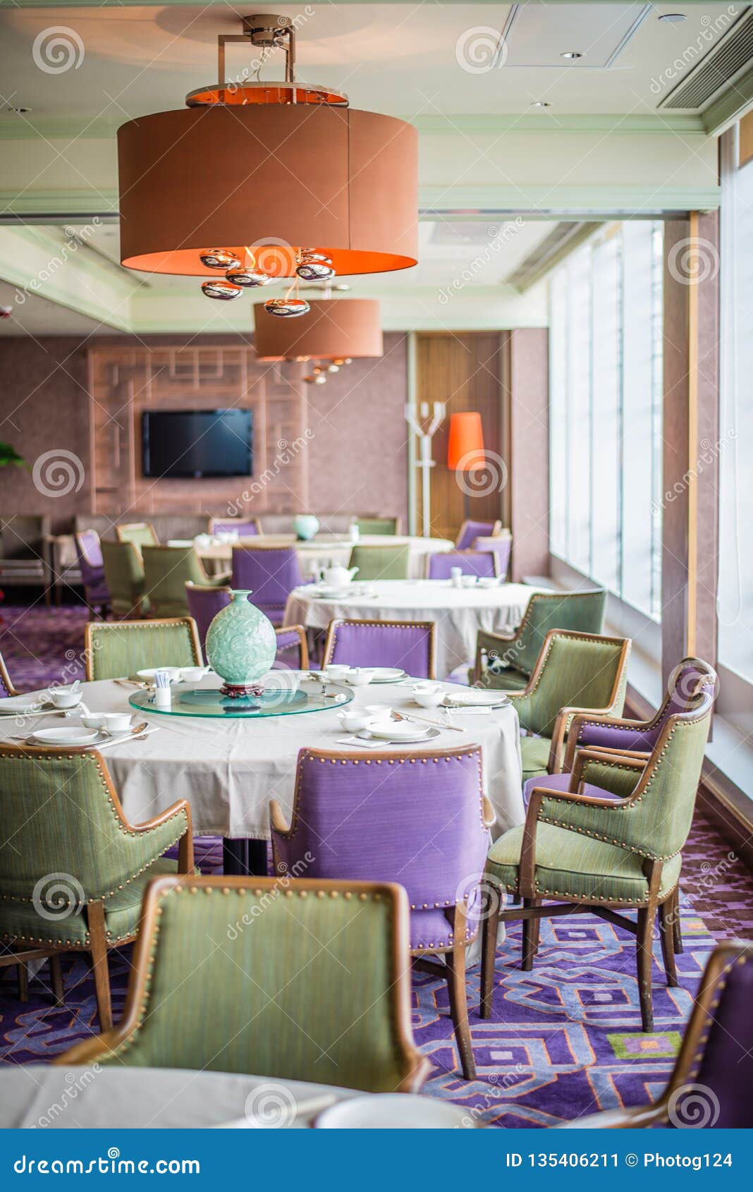 Beautiful Restaurant Interior with Round Tables and Colourful Seating ...