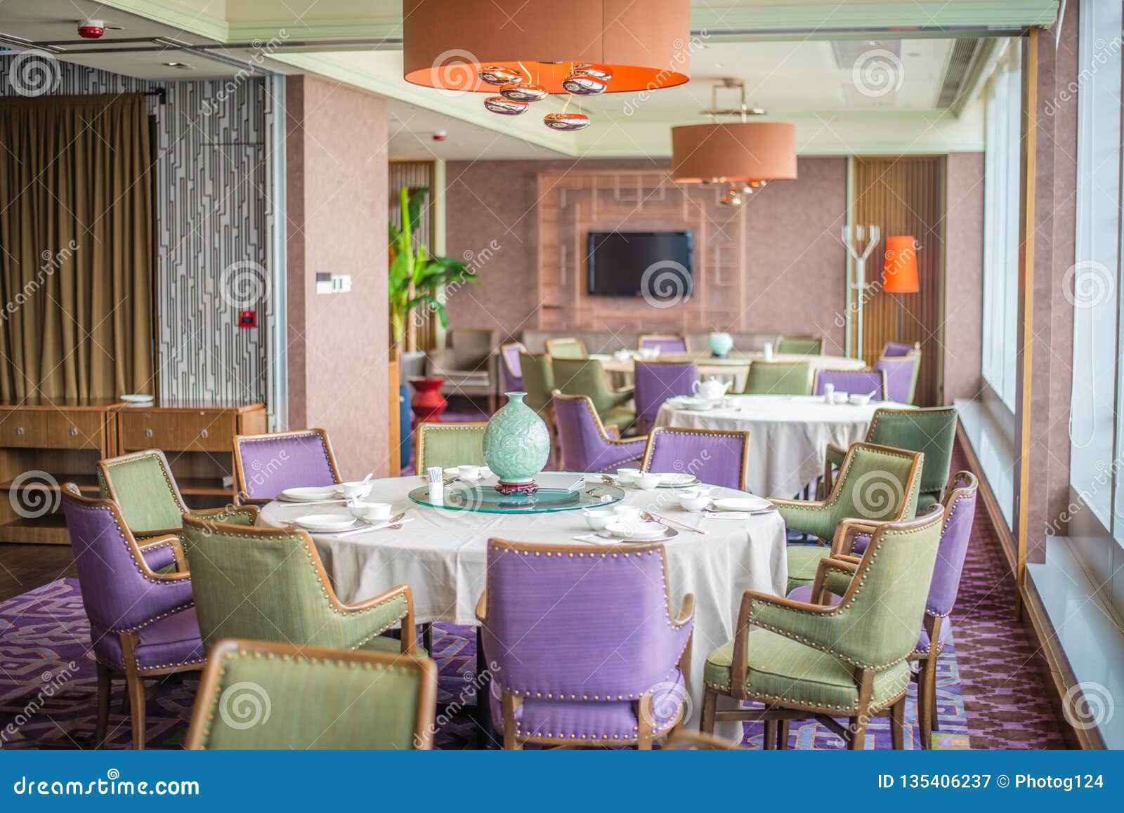 Beautiful Restaurant Interior with Round Tables and Colourful Seating ...