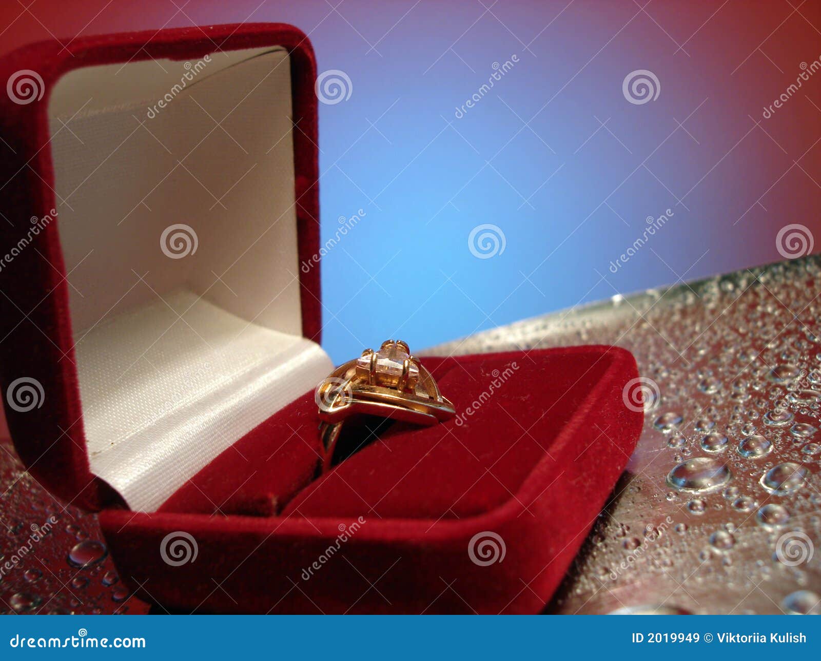 Beautiful Ring in Box on Blue and Silver Background with Drop of Stock ...