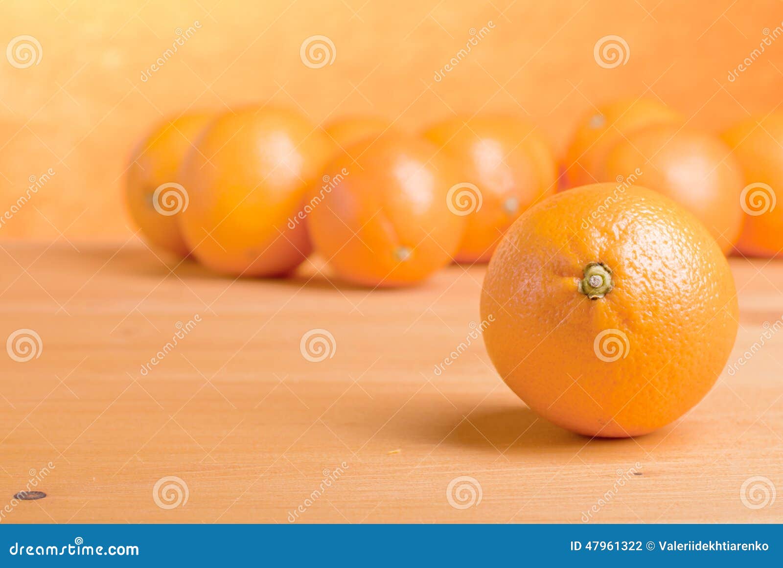 Beautiful Ripe Oranges on the Table and a Yellow Orange Background ...