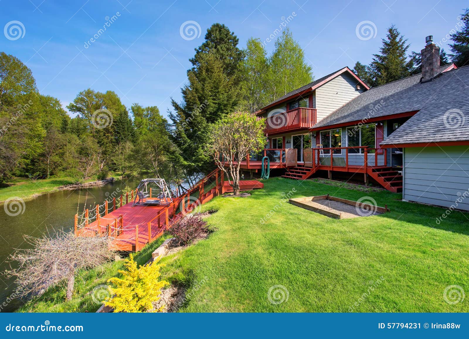 Beautiful Riverside House with Red Deck. Stock Image - Image of brown ...