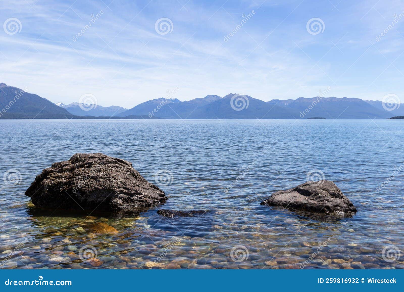 Beautiful Rocky Seashore with Mountains in the Distance Stock Photo ...