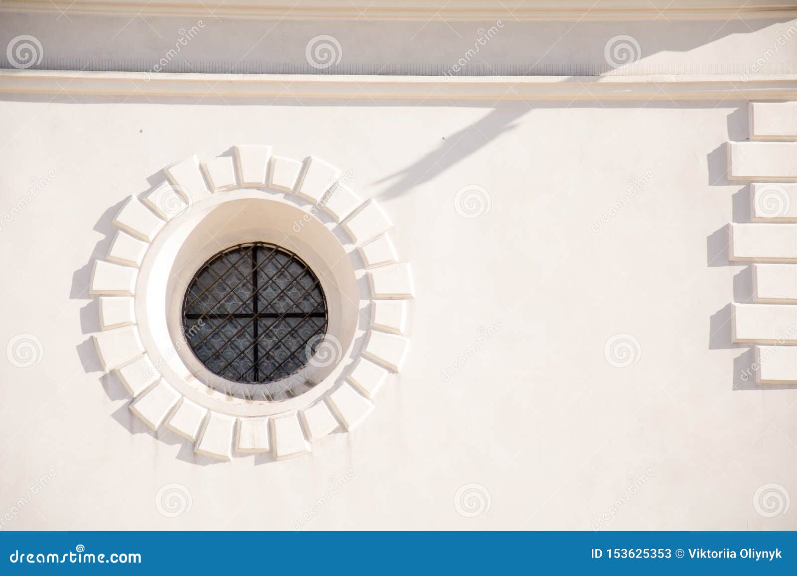 Round window on white wall stock image. Image of building - 153625353