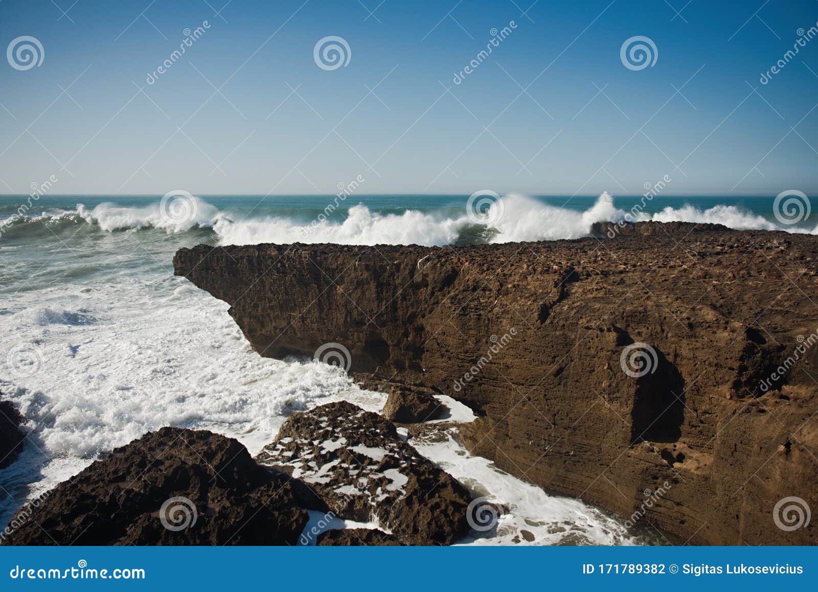 Beautiful Rugged Coastline with Waves Crashing Against the Cliffs Stock ...