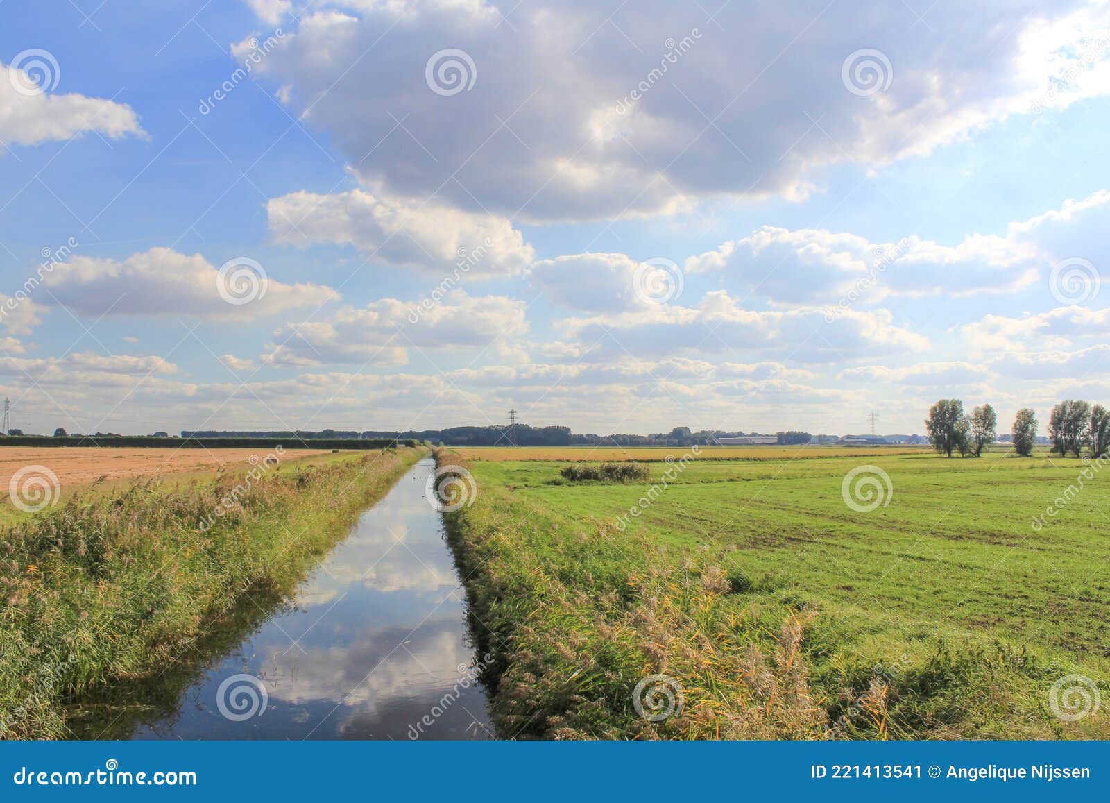 A Beautiful Rural Landscape with a Ditch and a Blue Cloudy Sky Stock ...