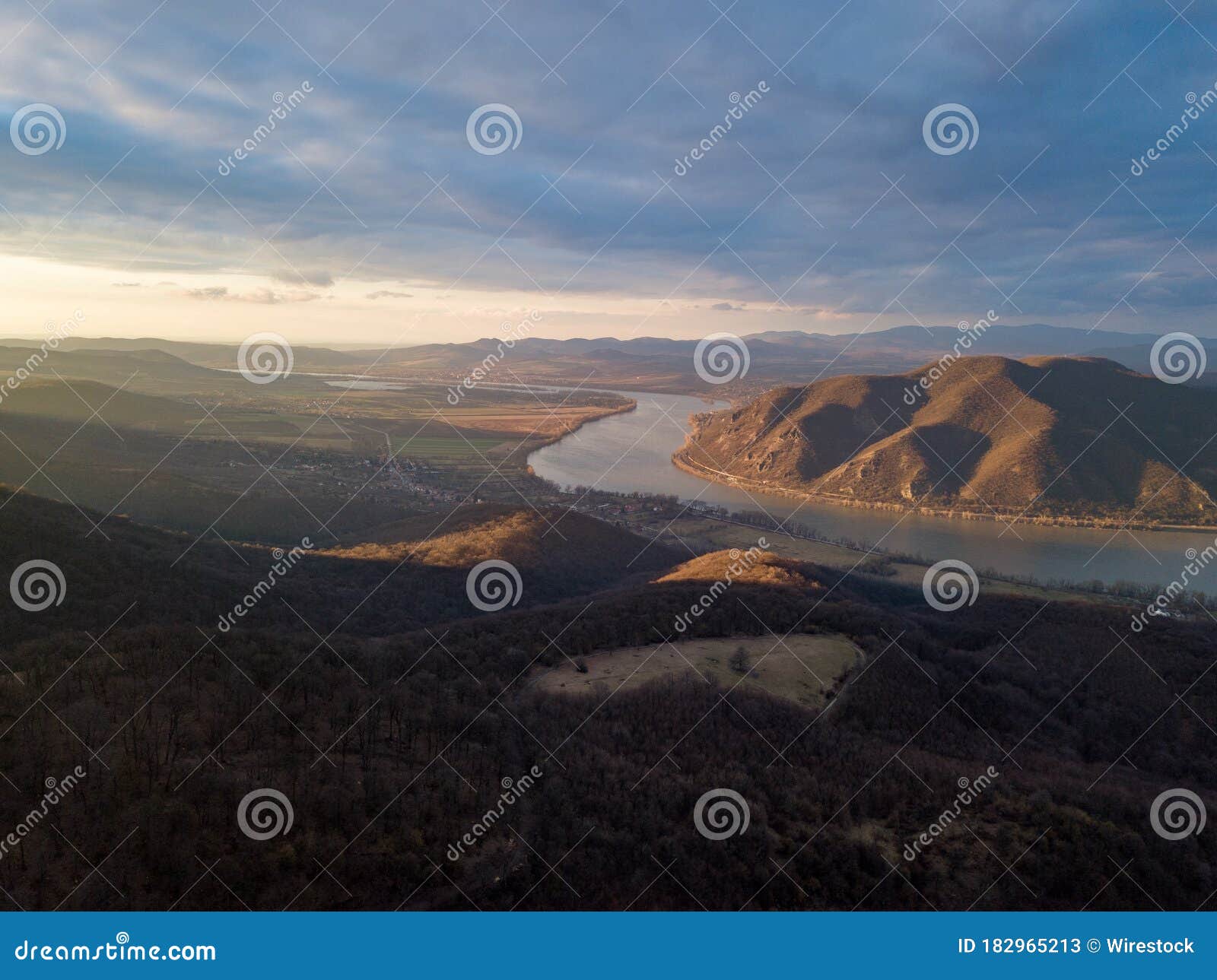 Beautiful Scene of a River between Hills and Forest Under the Cloudy ...