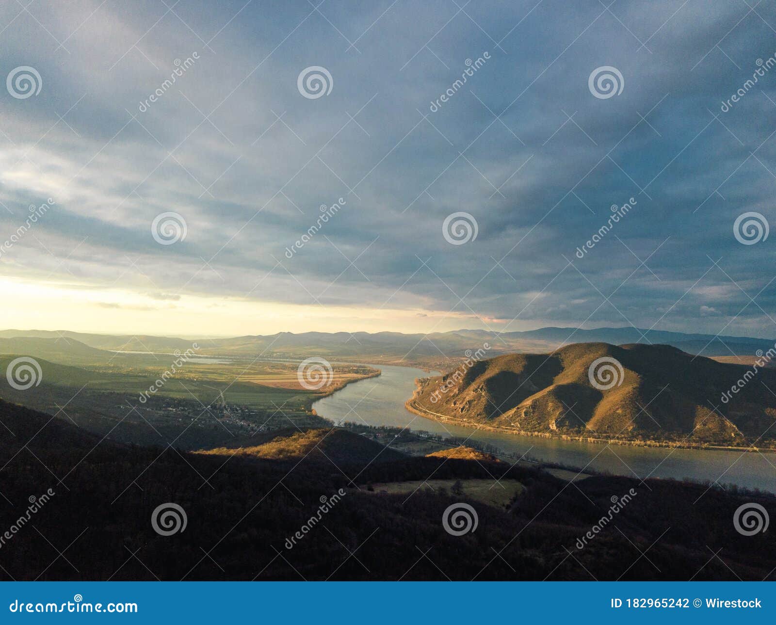 Beautiful Scene of a River between Hills and Forest Under the Cloudy ...