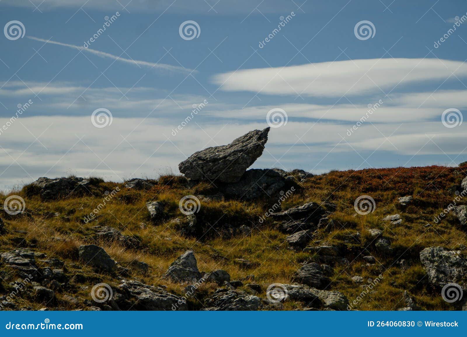 Beautiful Scenery of a Huge Rock on a Hill in Cloudy Sky Background in ...