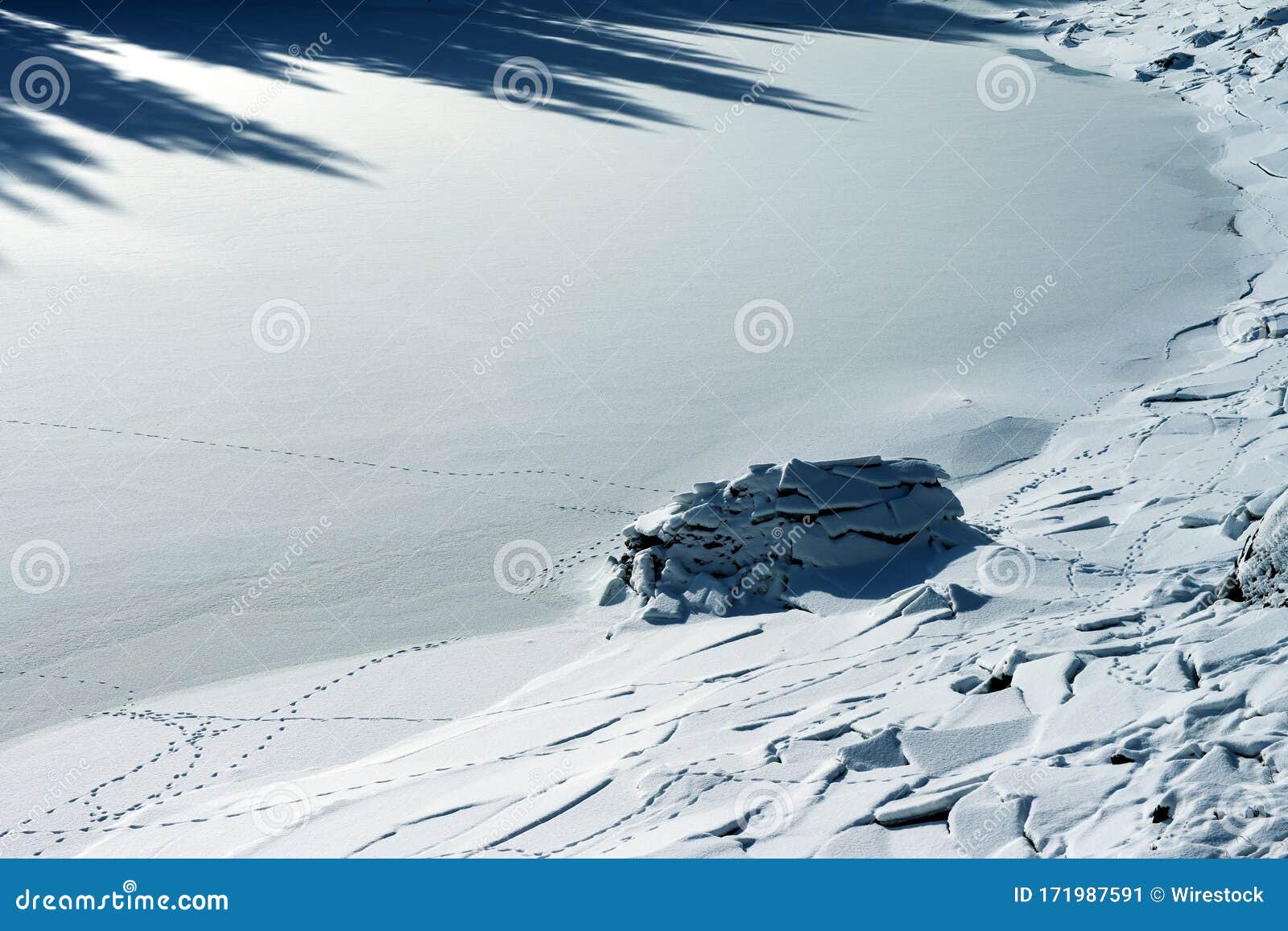 Beautiful Scenery of Land Covered with Snow with Cracks in the ...