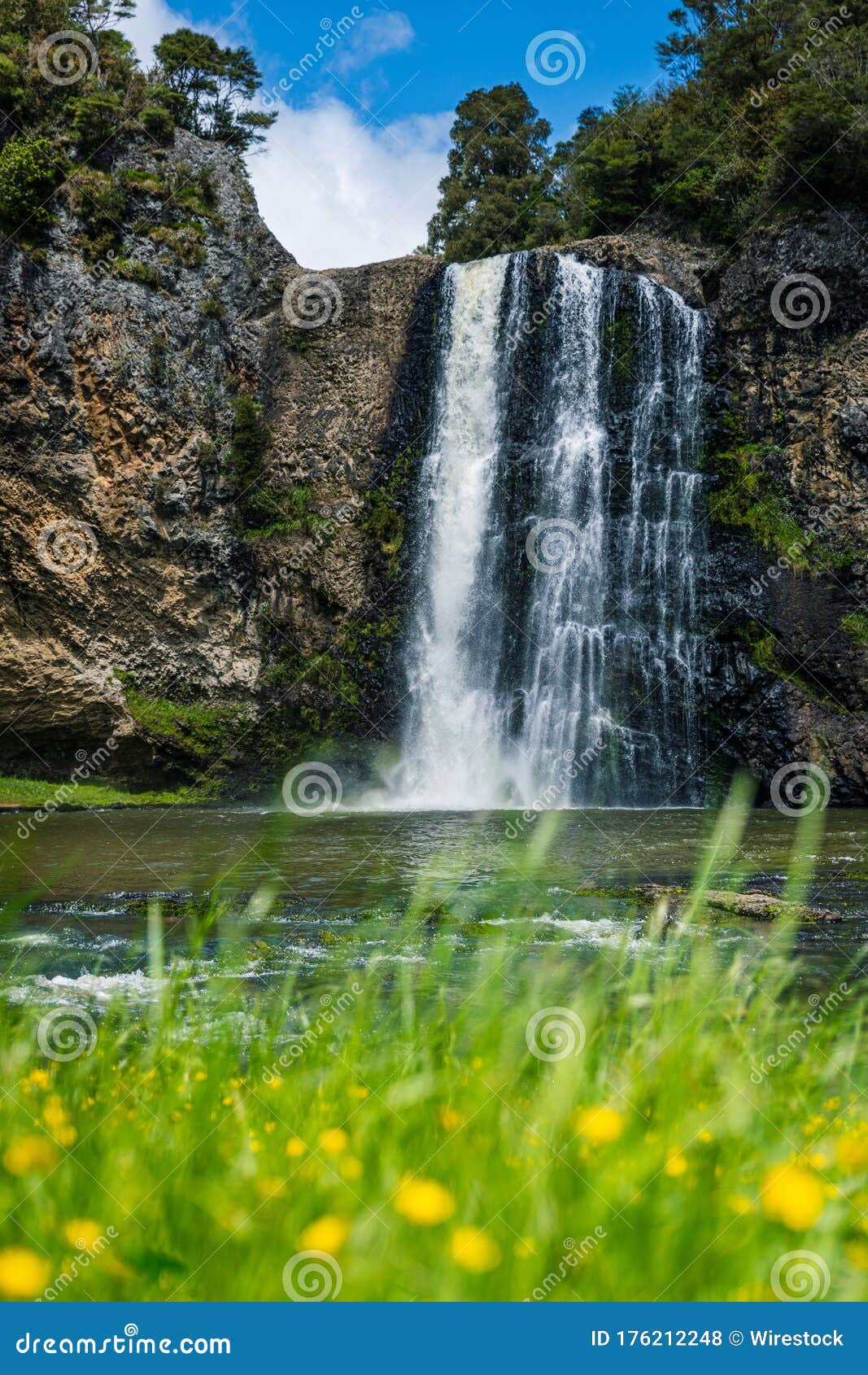 Beautiful Scenery of a Powerful Waterfall Flowing through a Cliff into ...