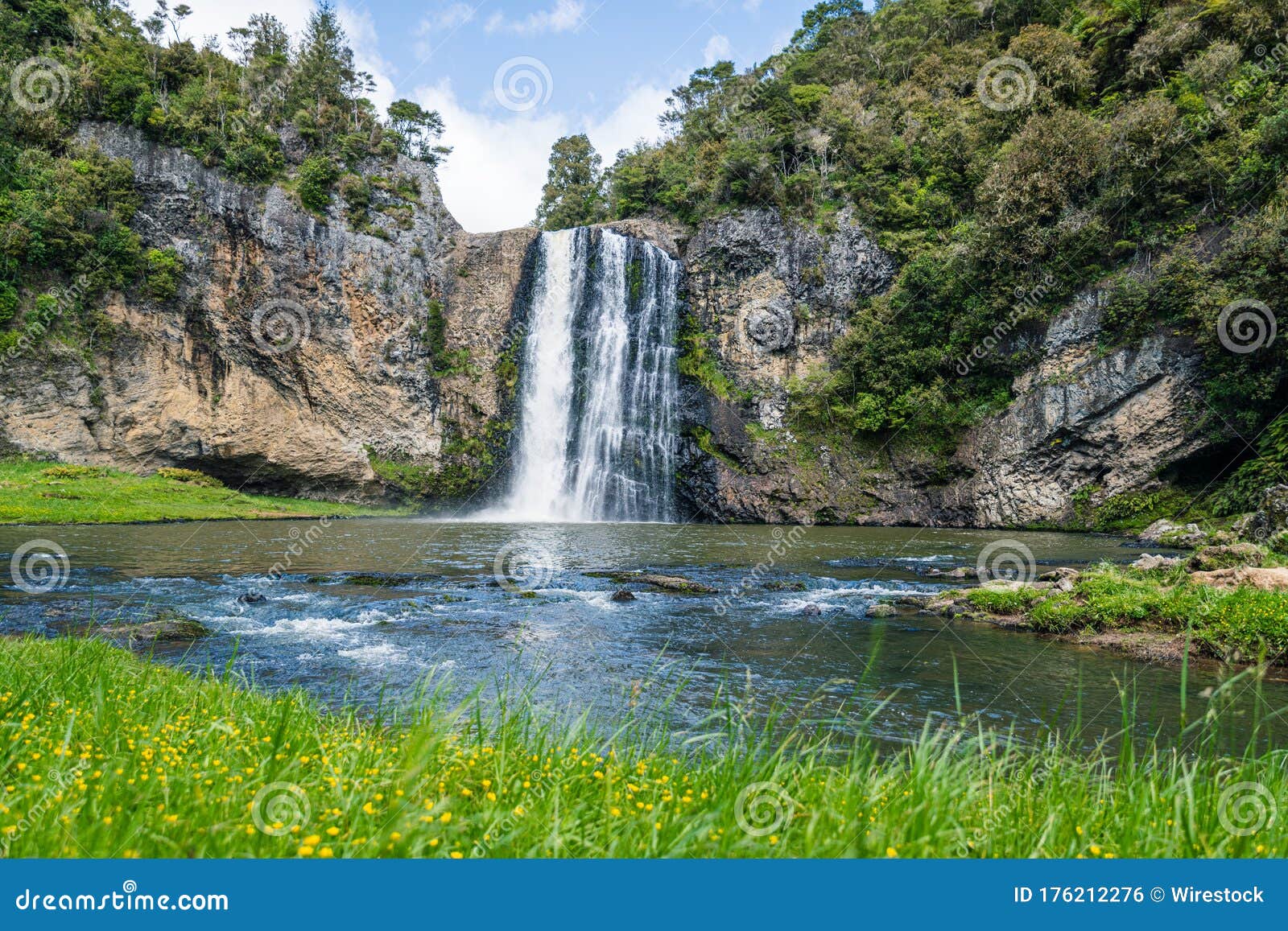 Beautiful Scenery of a Powerful Waterfall Flowing through a Cliff into ...