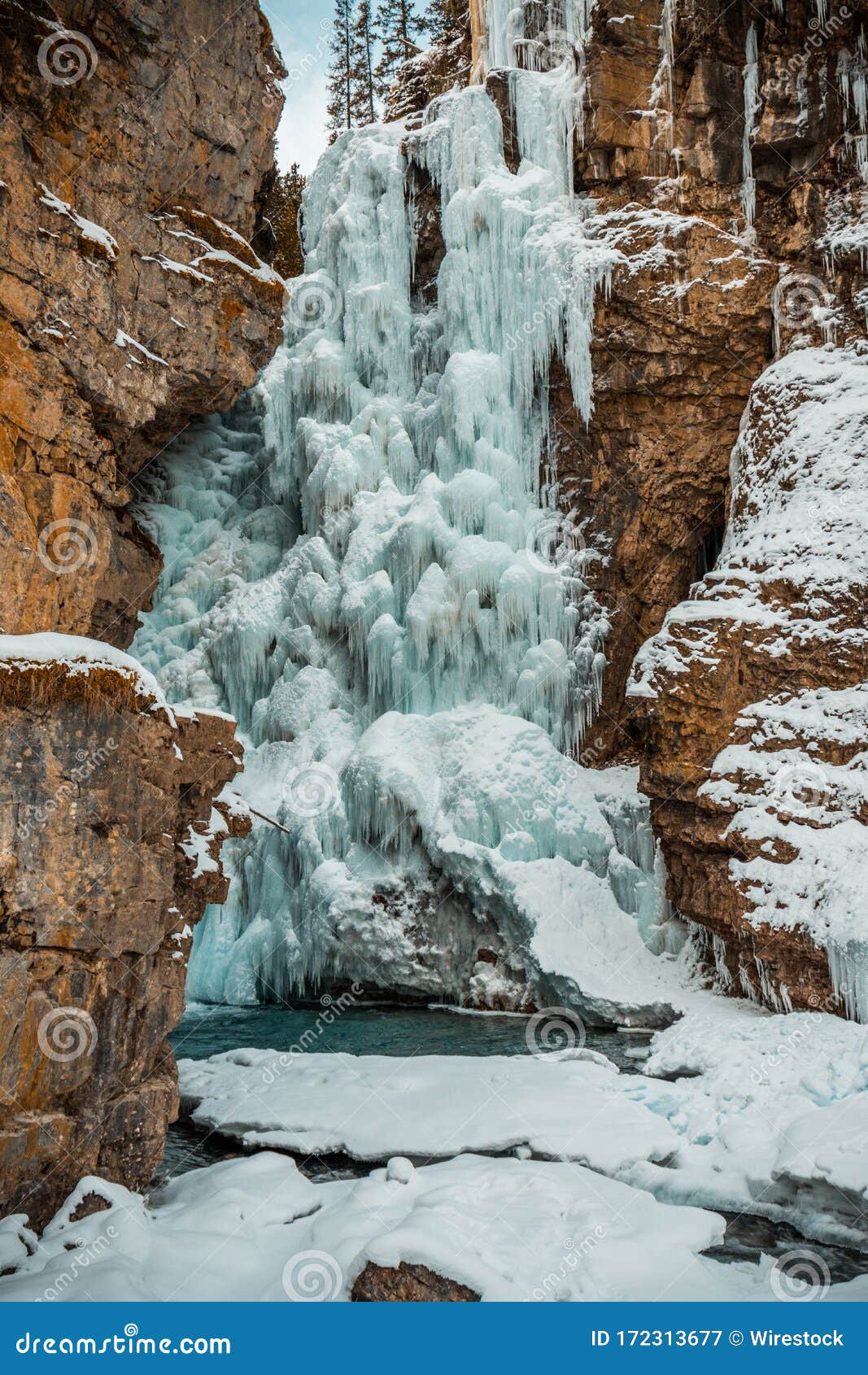Beautiful Scenery of a Powerful Waterfall Surrounded by Rock Formations ...