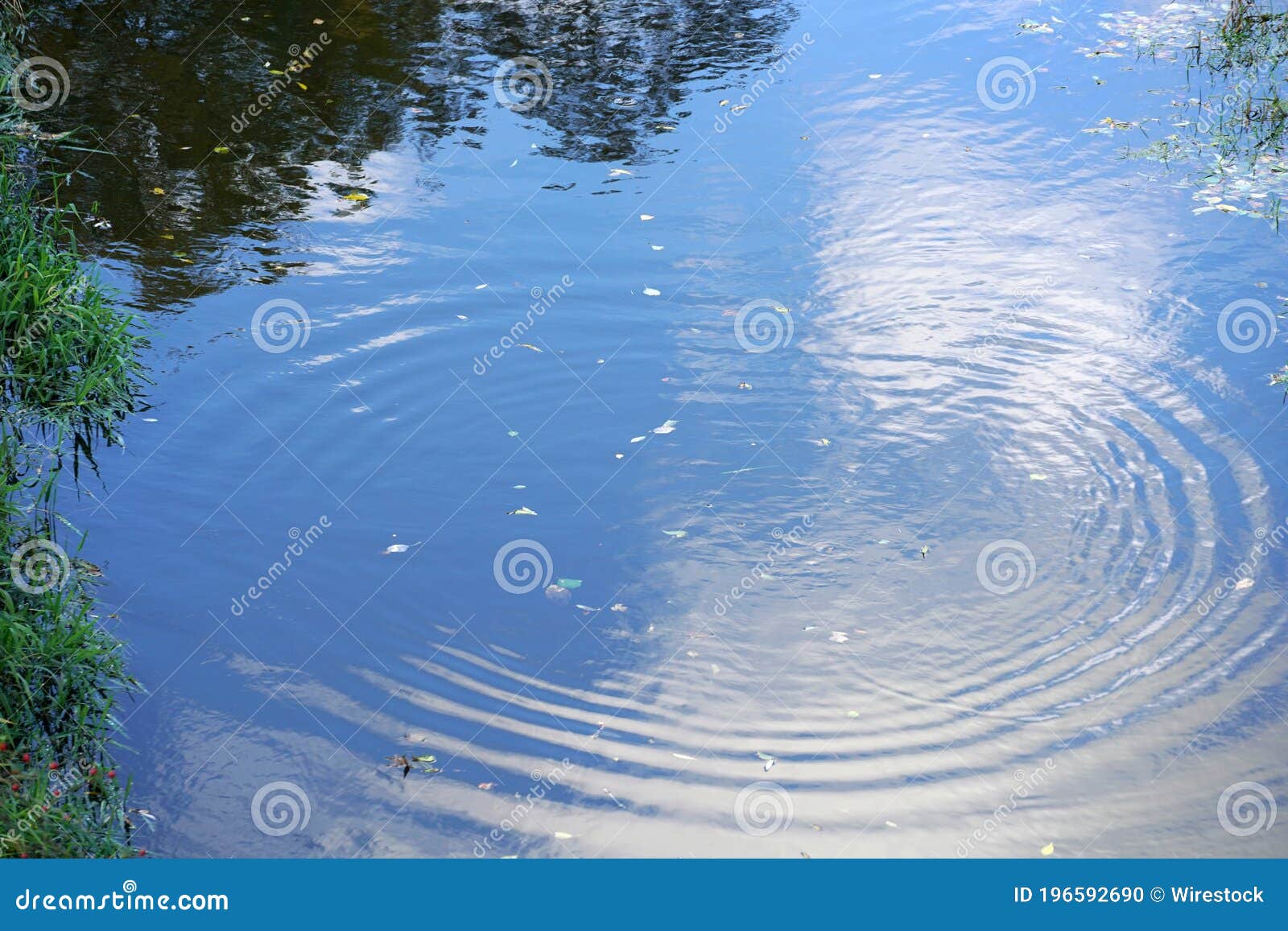 Beautiful Scenery of a Reflective Lake with Splashes Stock Photo ...