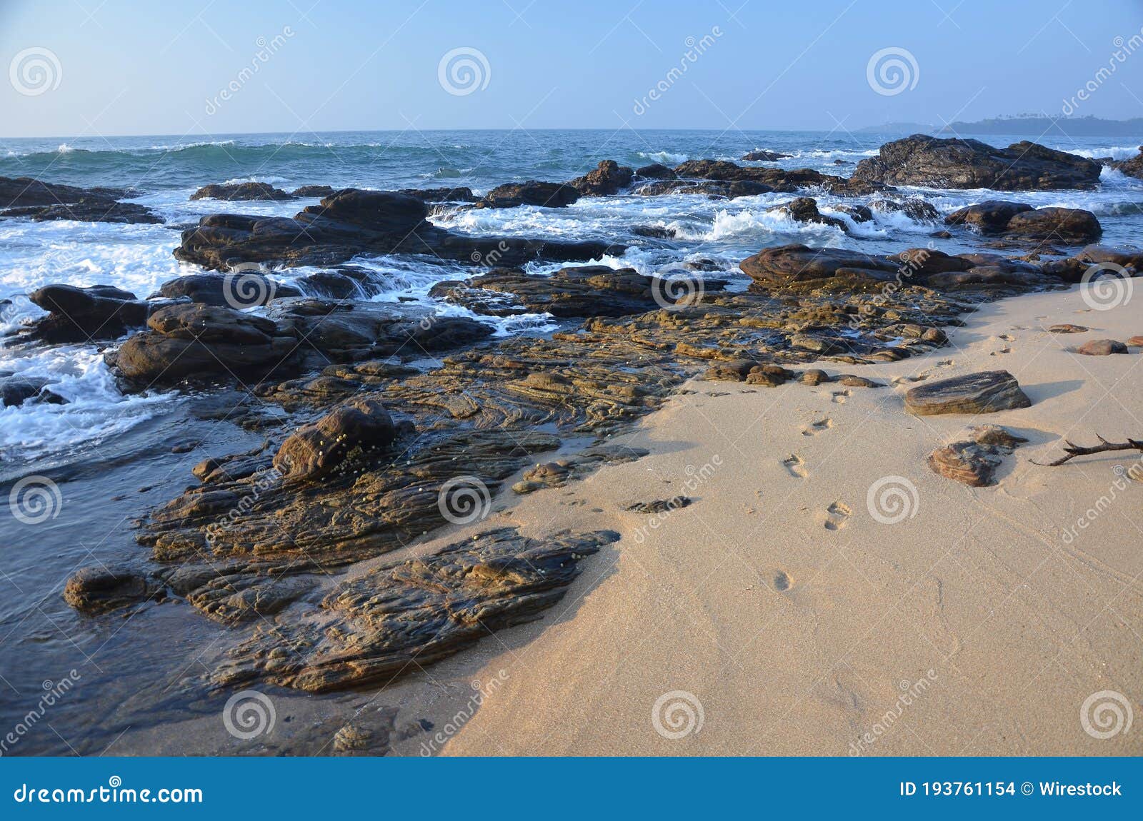 Beautiful Scenery of Rock Formations on the Beach with Splashing Sea ...