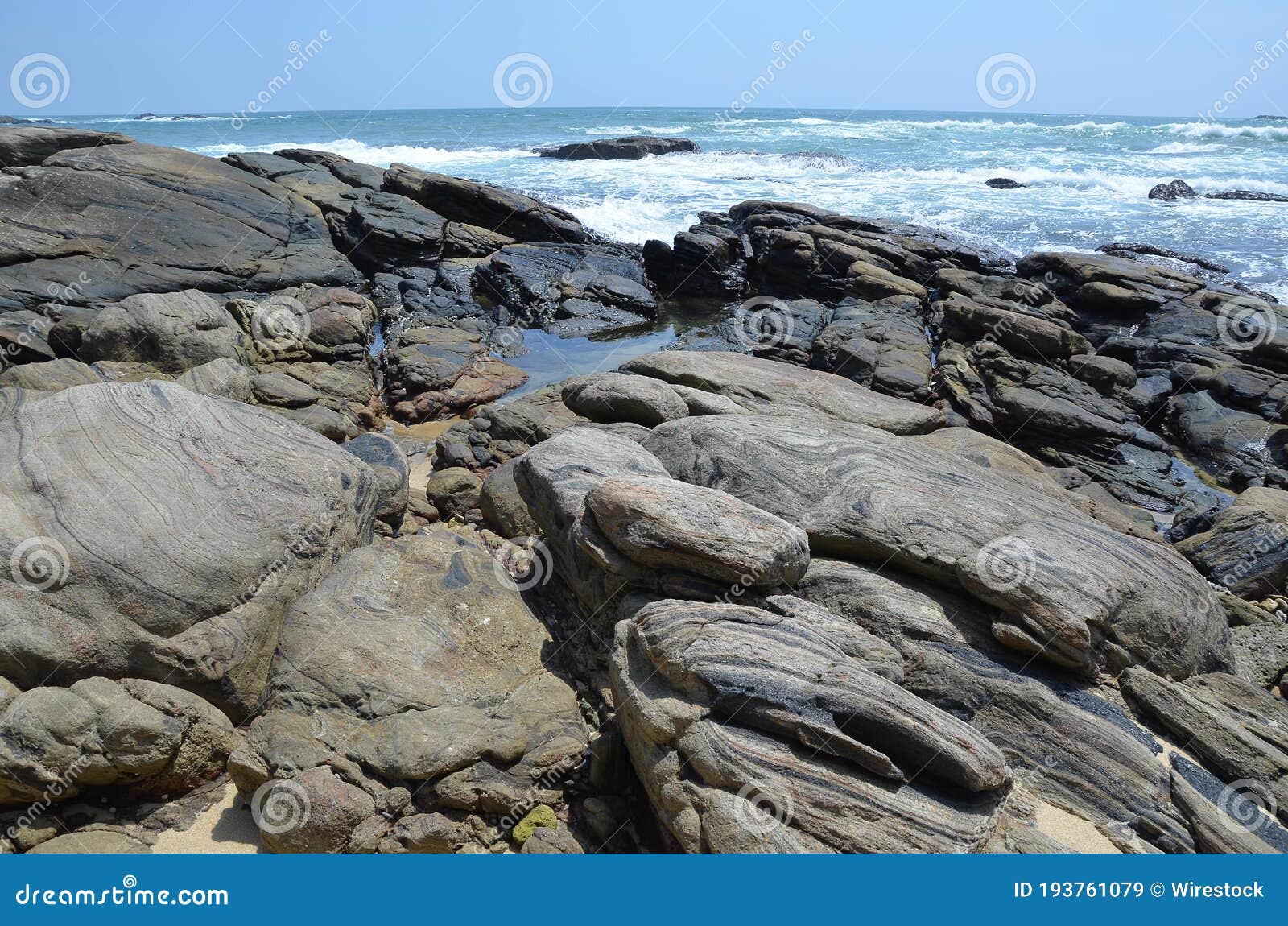 Beautiful Scenery of Rock Formations on the Beach with Splashing Sea ...
