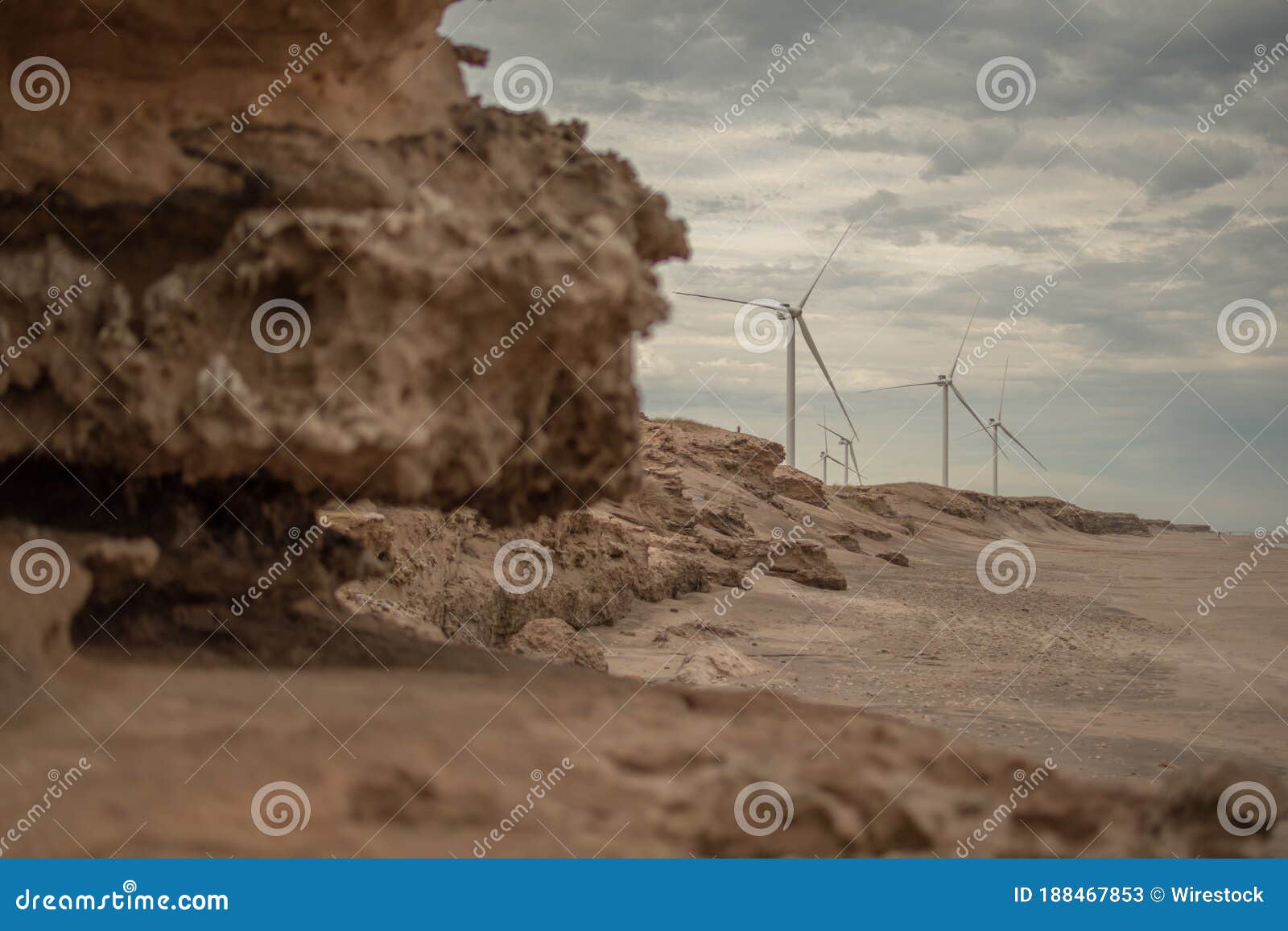 Beautiful Scenery of a Sandy Beach with Rocks on a Cloudy Sky ...