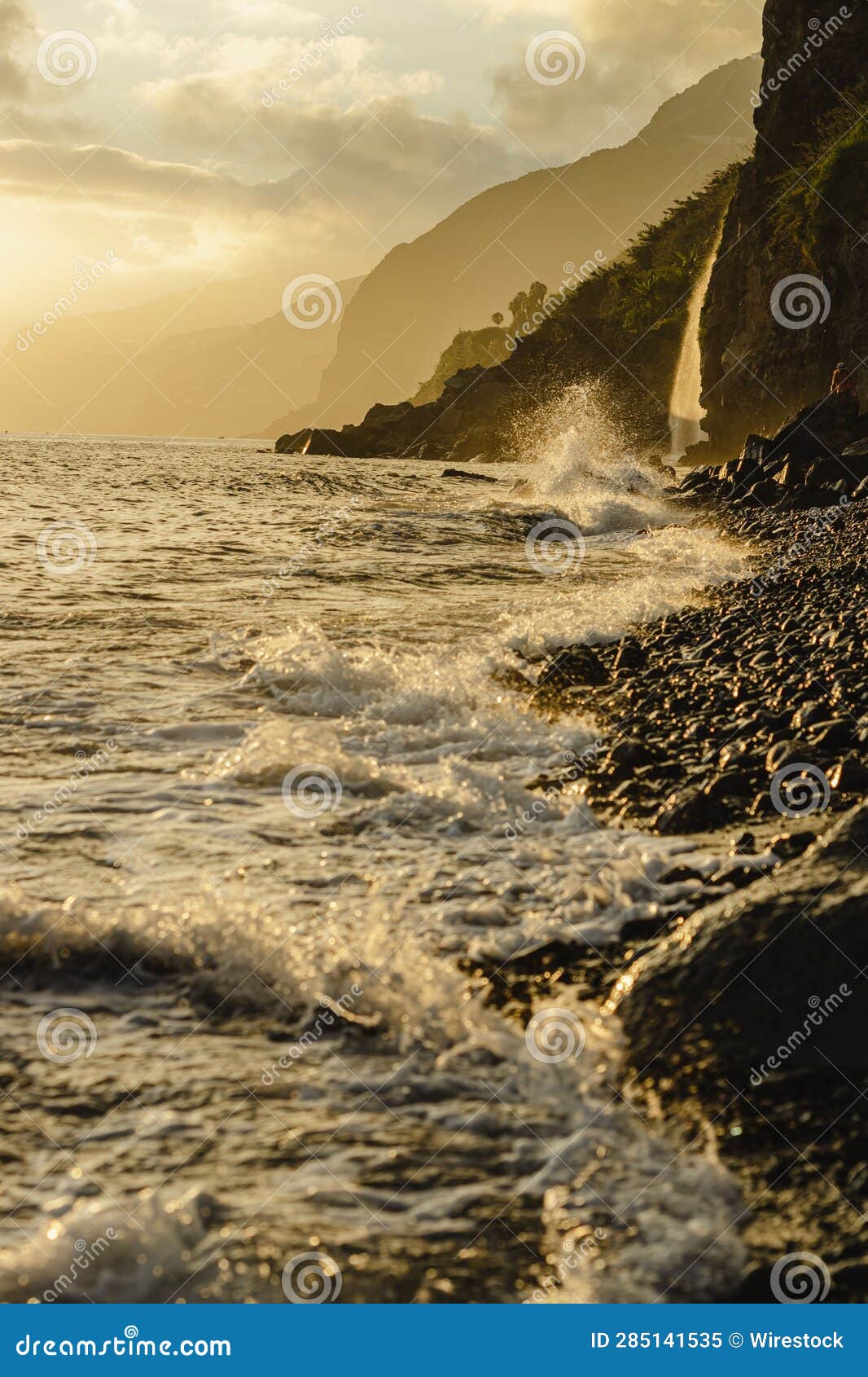 Beautiful Seascape of a Cliffside with a Powerful Waterfall Cascading ...