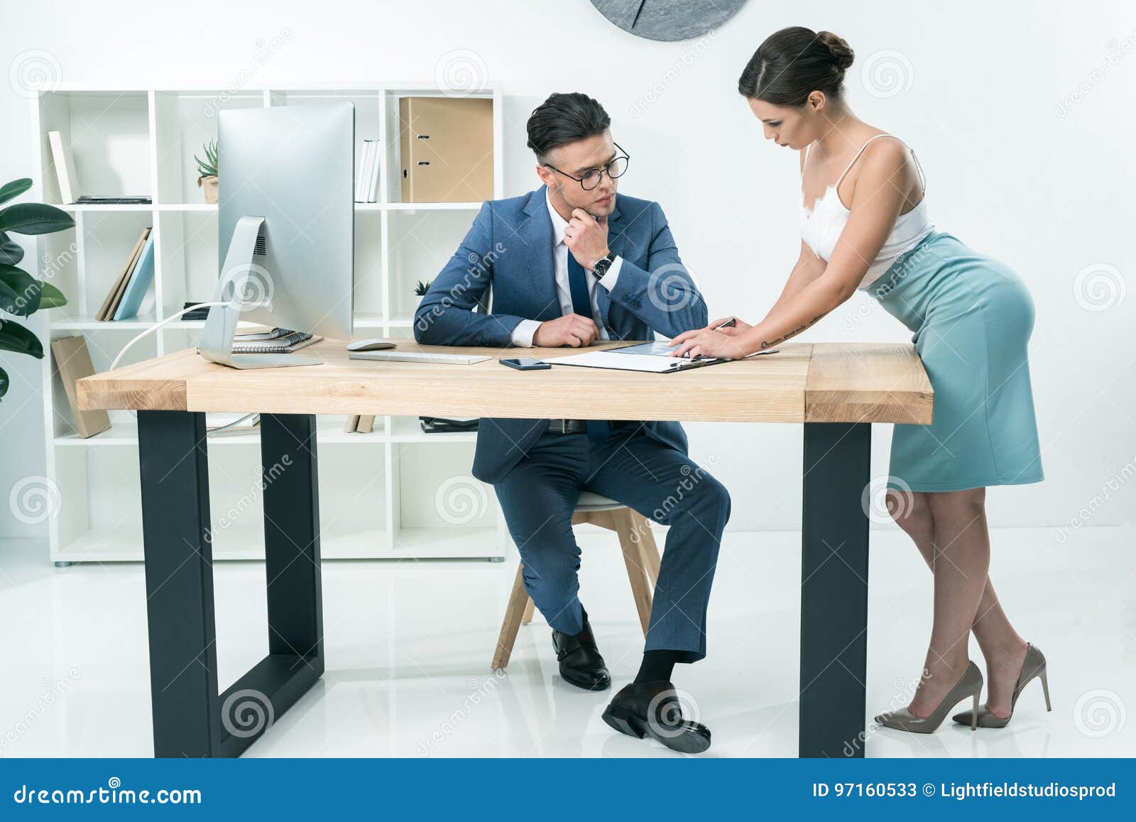 Beautiful Secretary Talking To Her Boss at Office Stock Image - Image ...