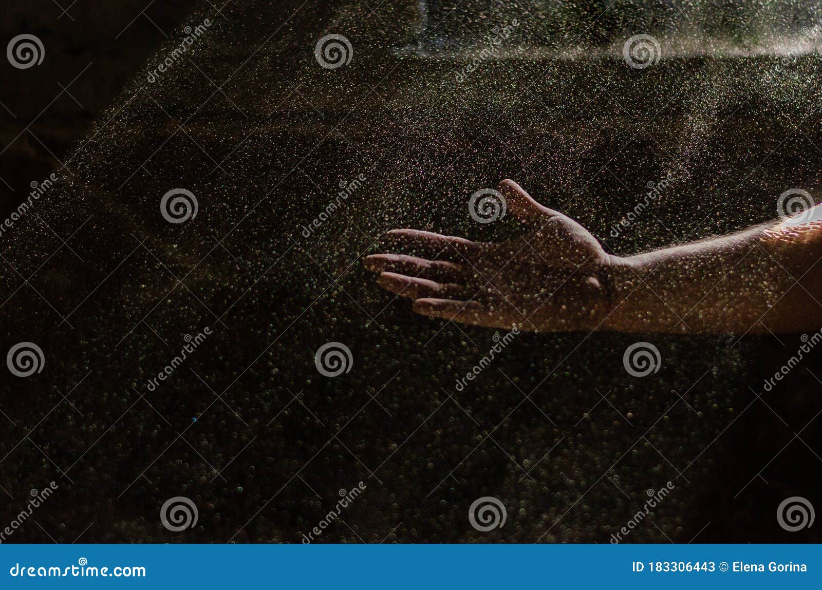 Beautiful Set of Dust Particles and a Hand Against the Background of ...