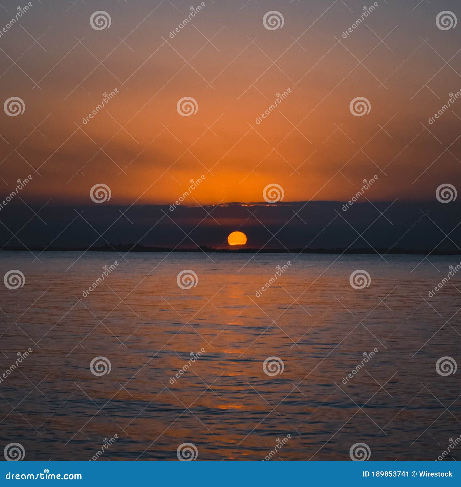 Beautiful Setting Sun on the Beach Stock Image - Image of blue, evening ...