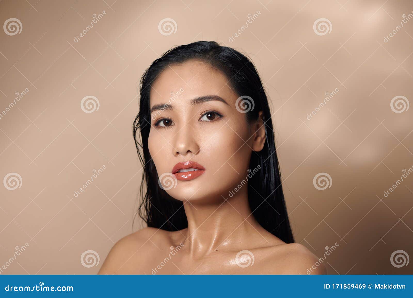 Beautiful Asian Woman Model Posing On Beige Background Stock Image